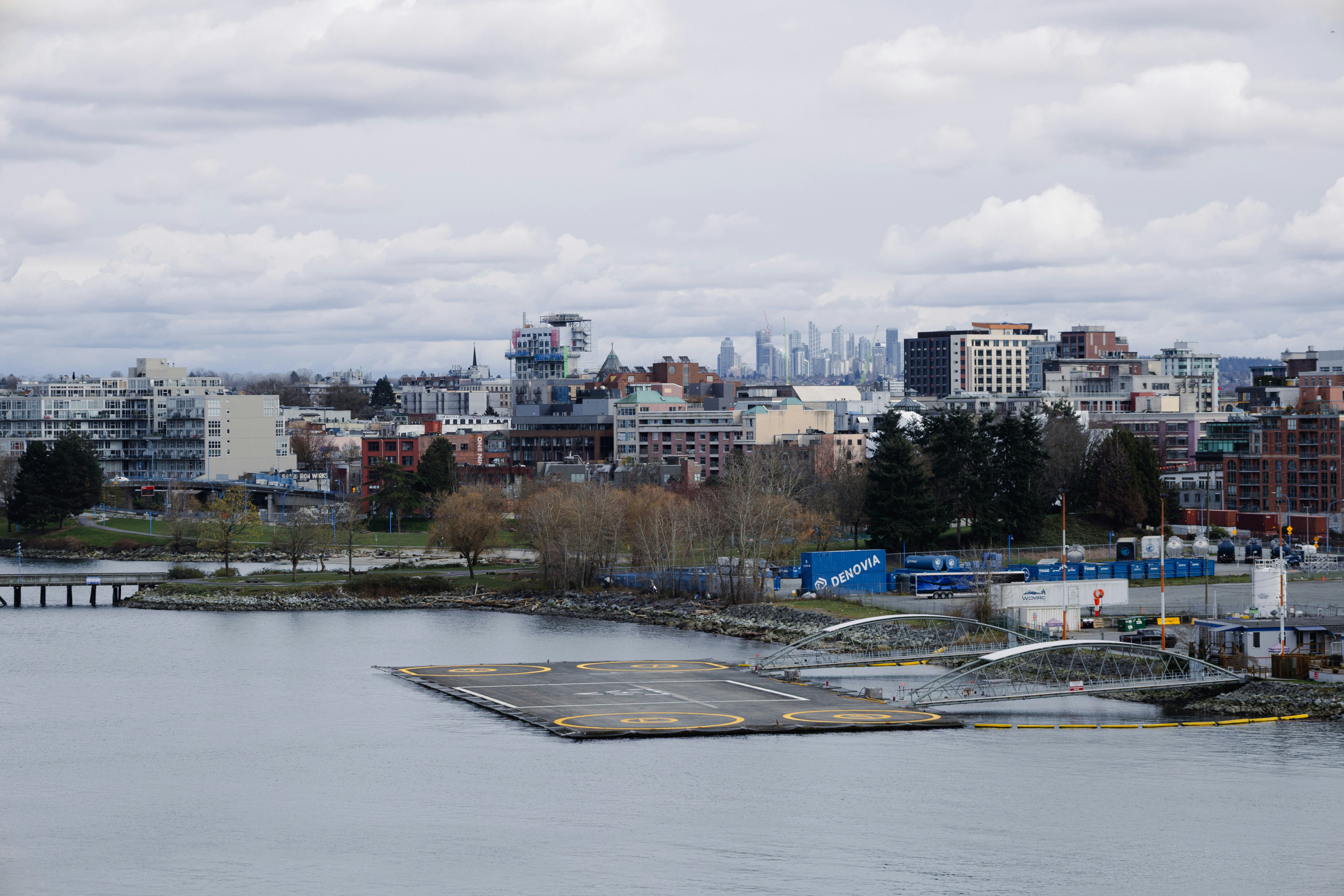 Urban Waterfront Vista: Riverside Docks Meet City Horizons