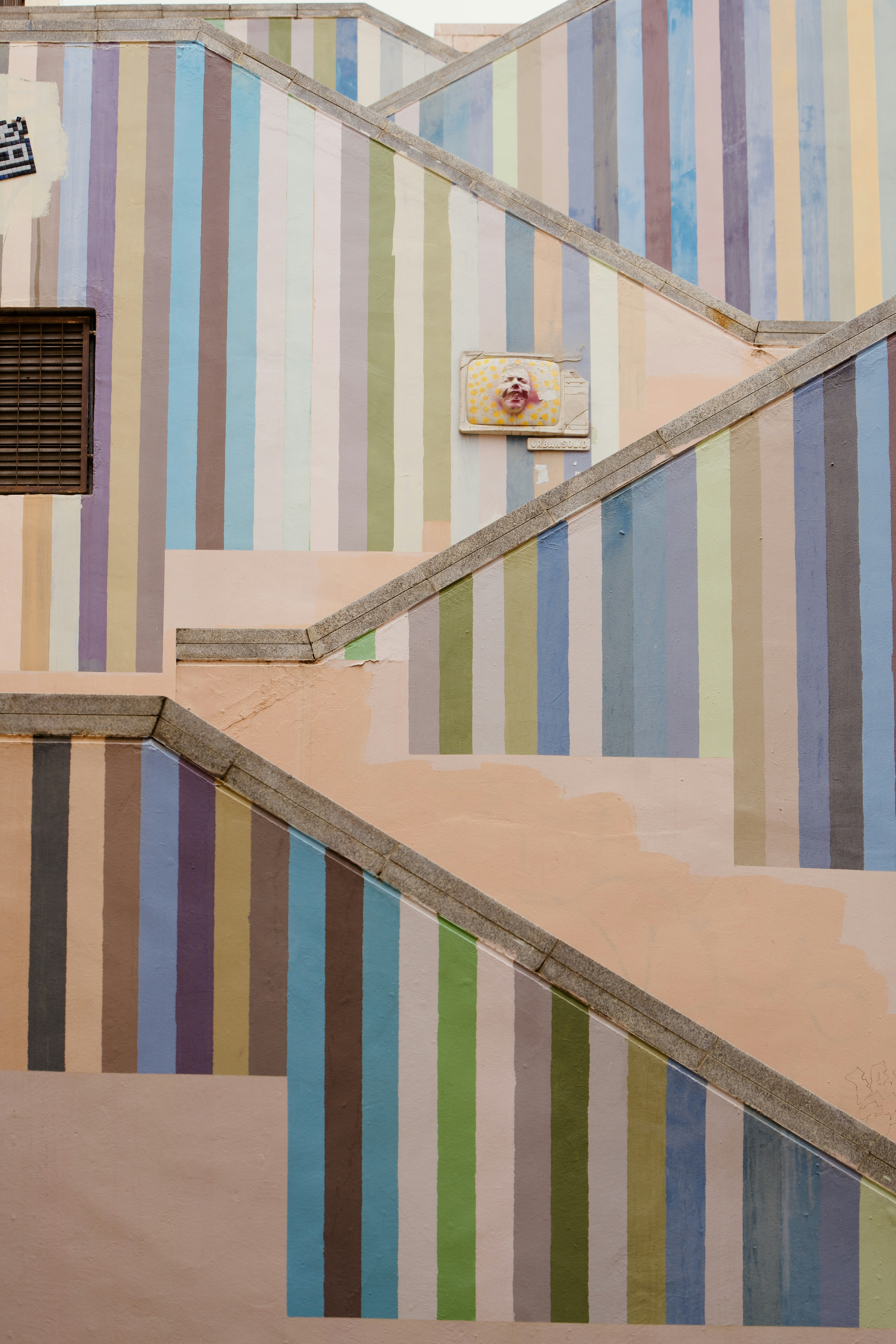 Diagonal Stripes: A Staircase of Color on a Painted Wall