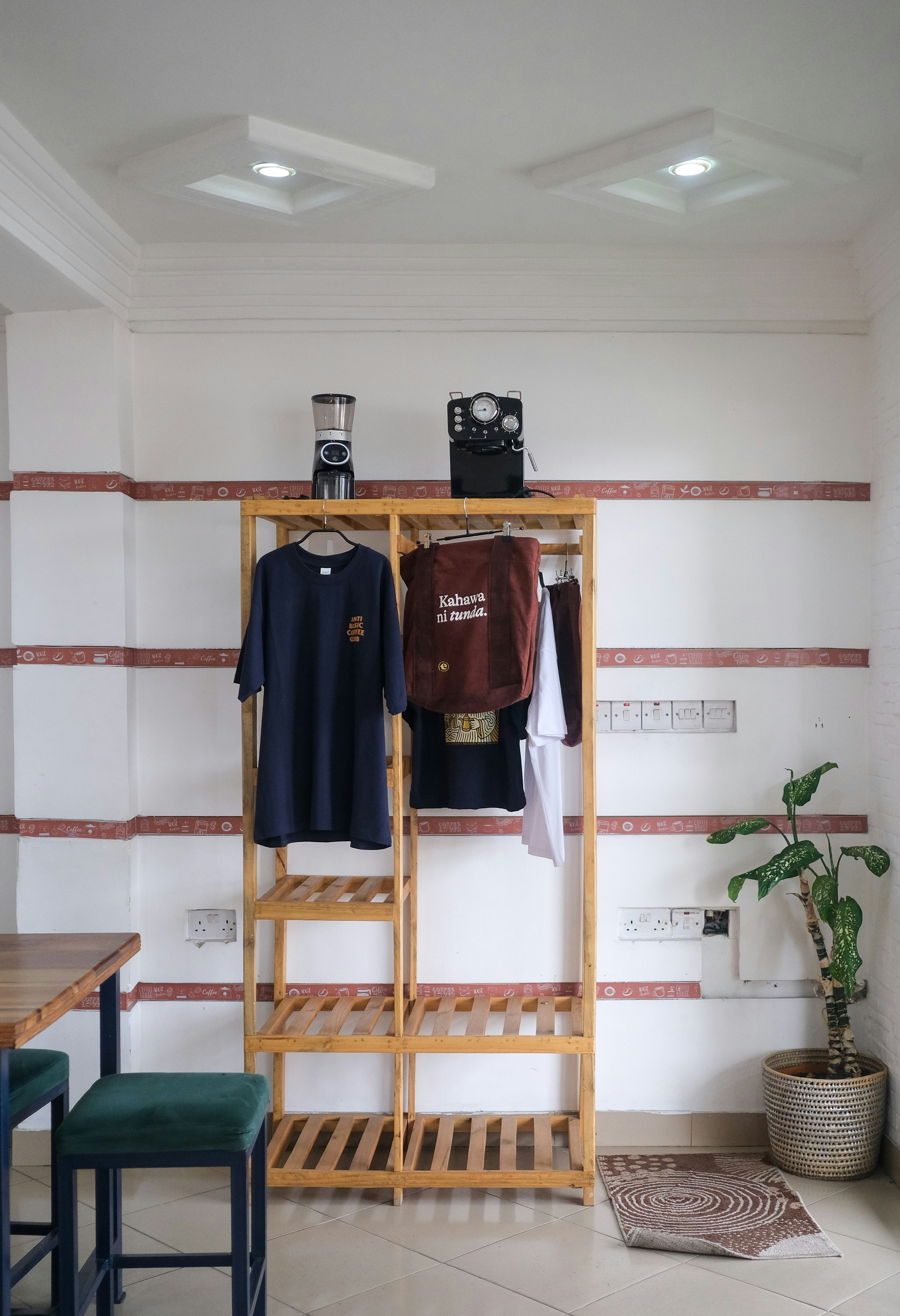 Wooden Wardrobe with Clothes and Retro Speakers in Quiet Studio Corner
