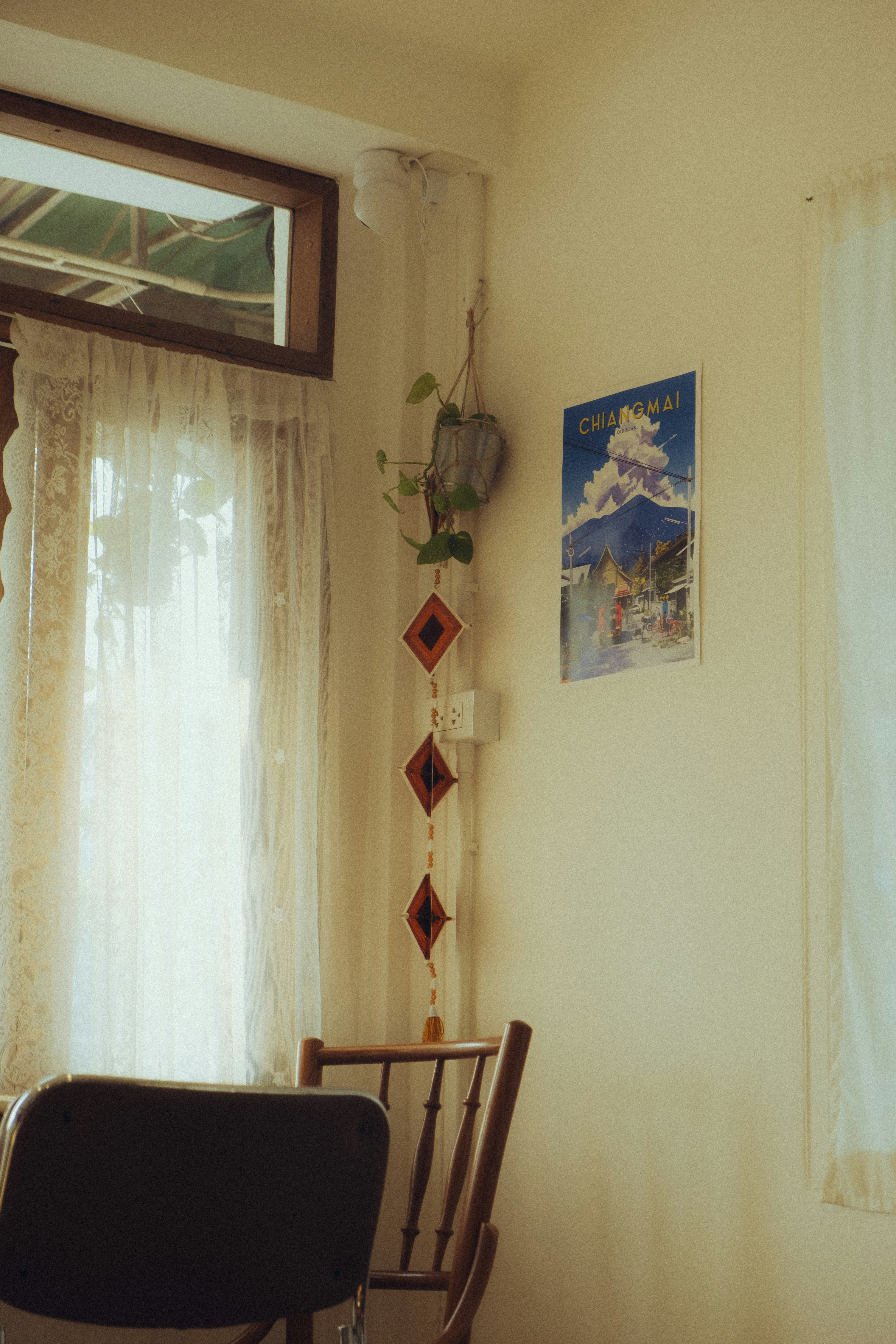 Quiet Corner: Plant, Ornaments, and Hanging Diamonds by Window Light