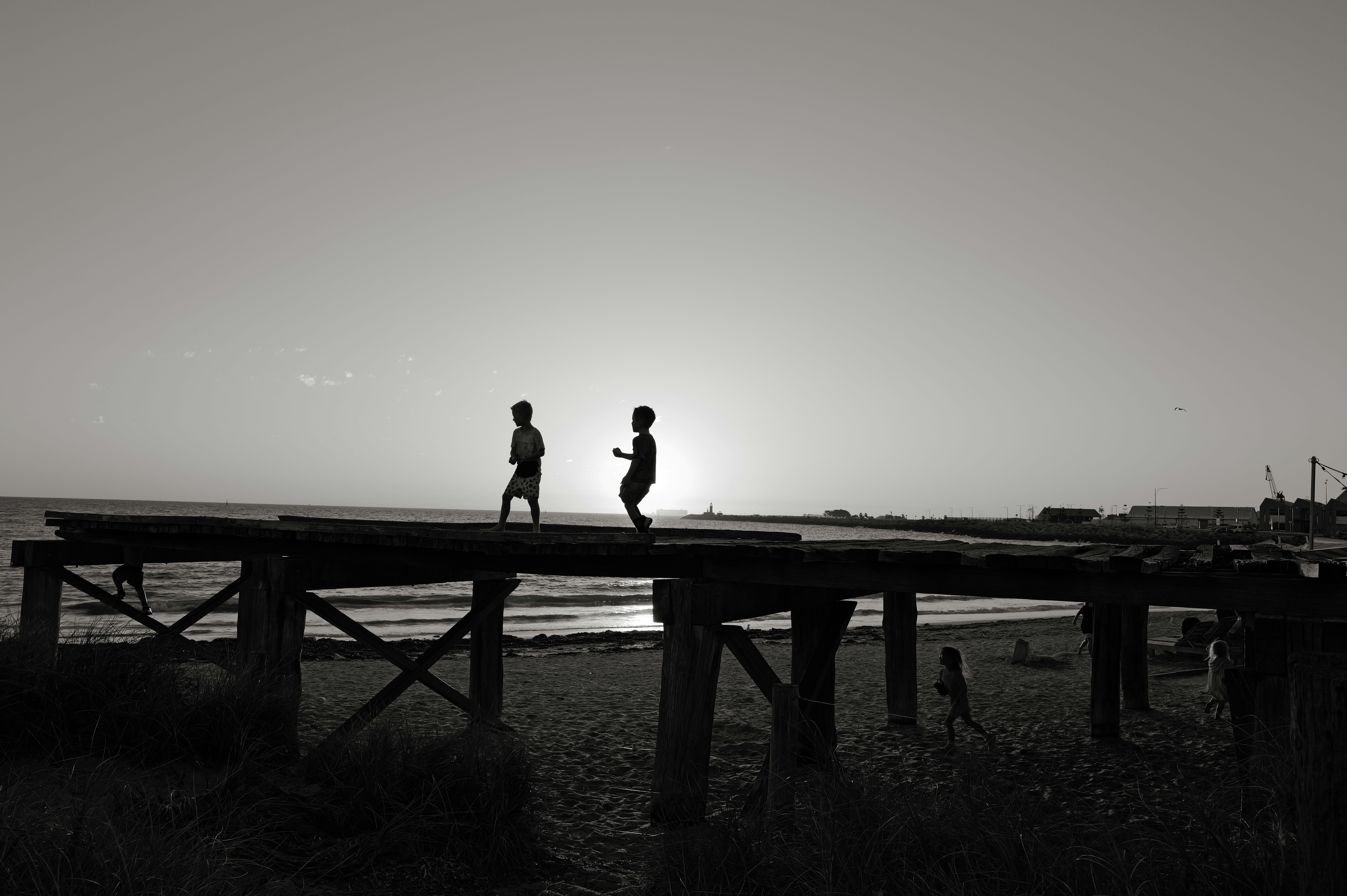 Silhouettes on the Pier at Dusk