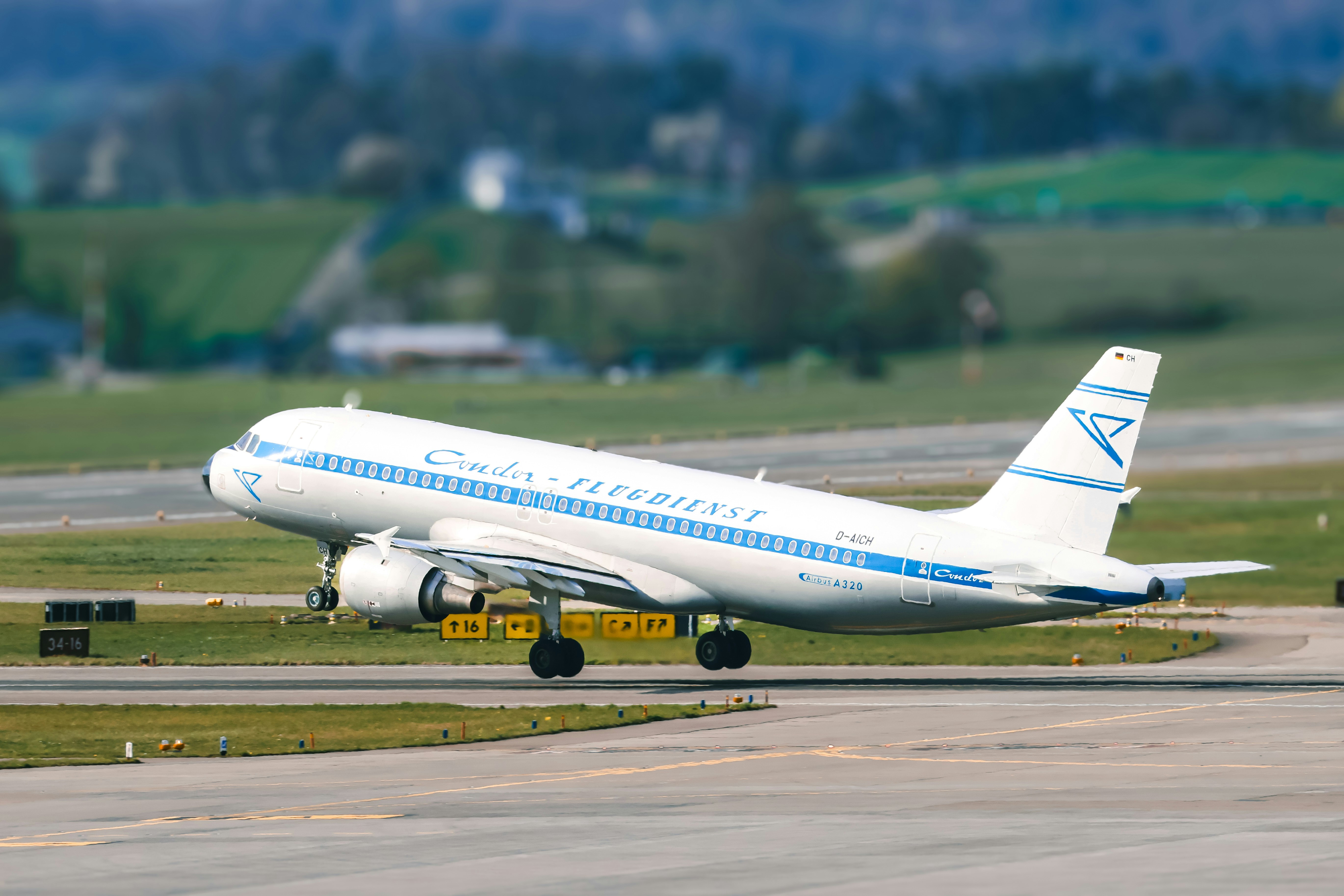 Taxiing Beauty: A Quiet Moment of Lift on the Airport Tarmac