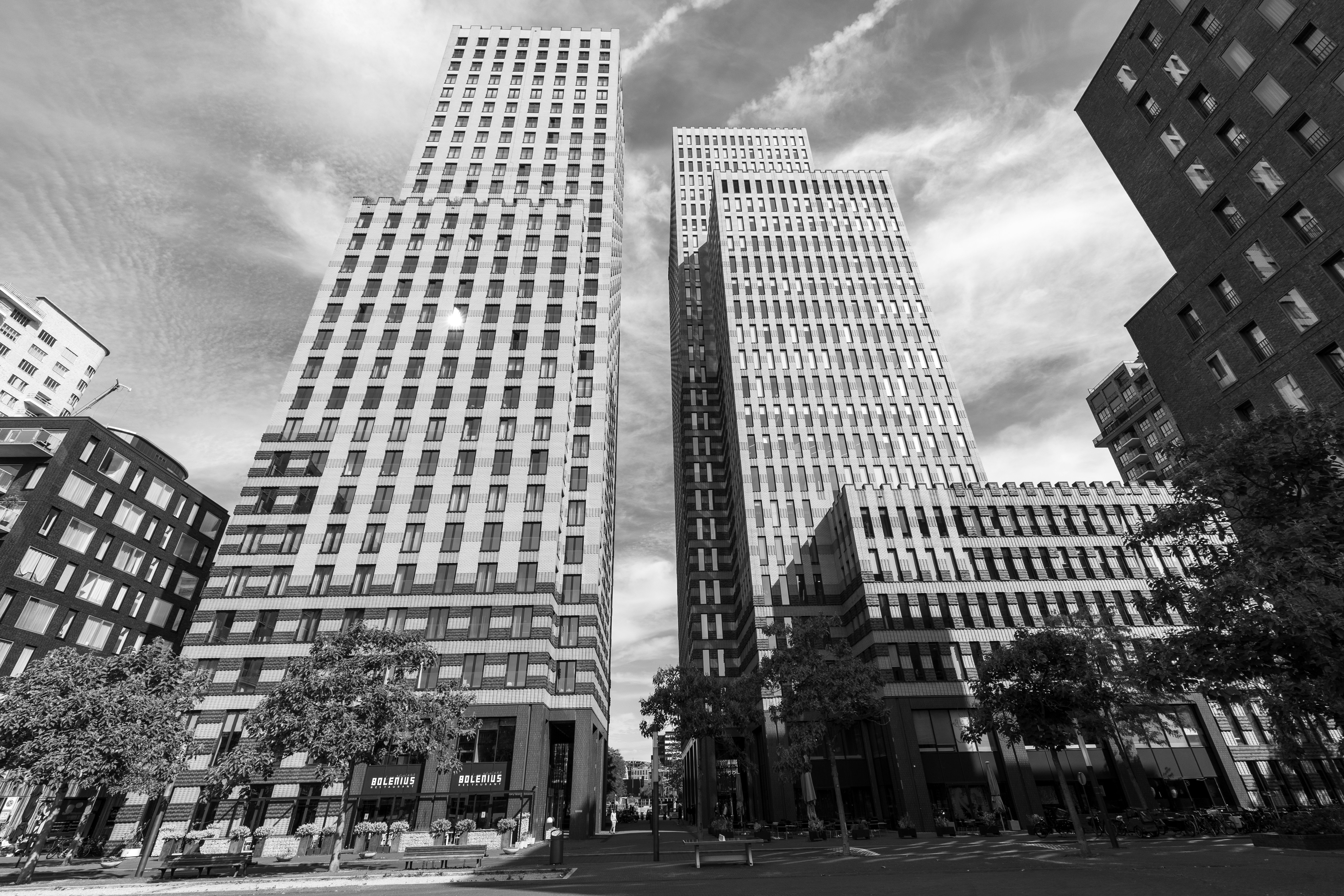 Urban Canopy: Skyward Towers Under Shifting Clouds