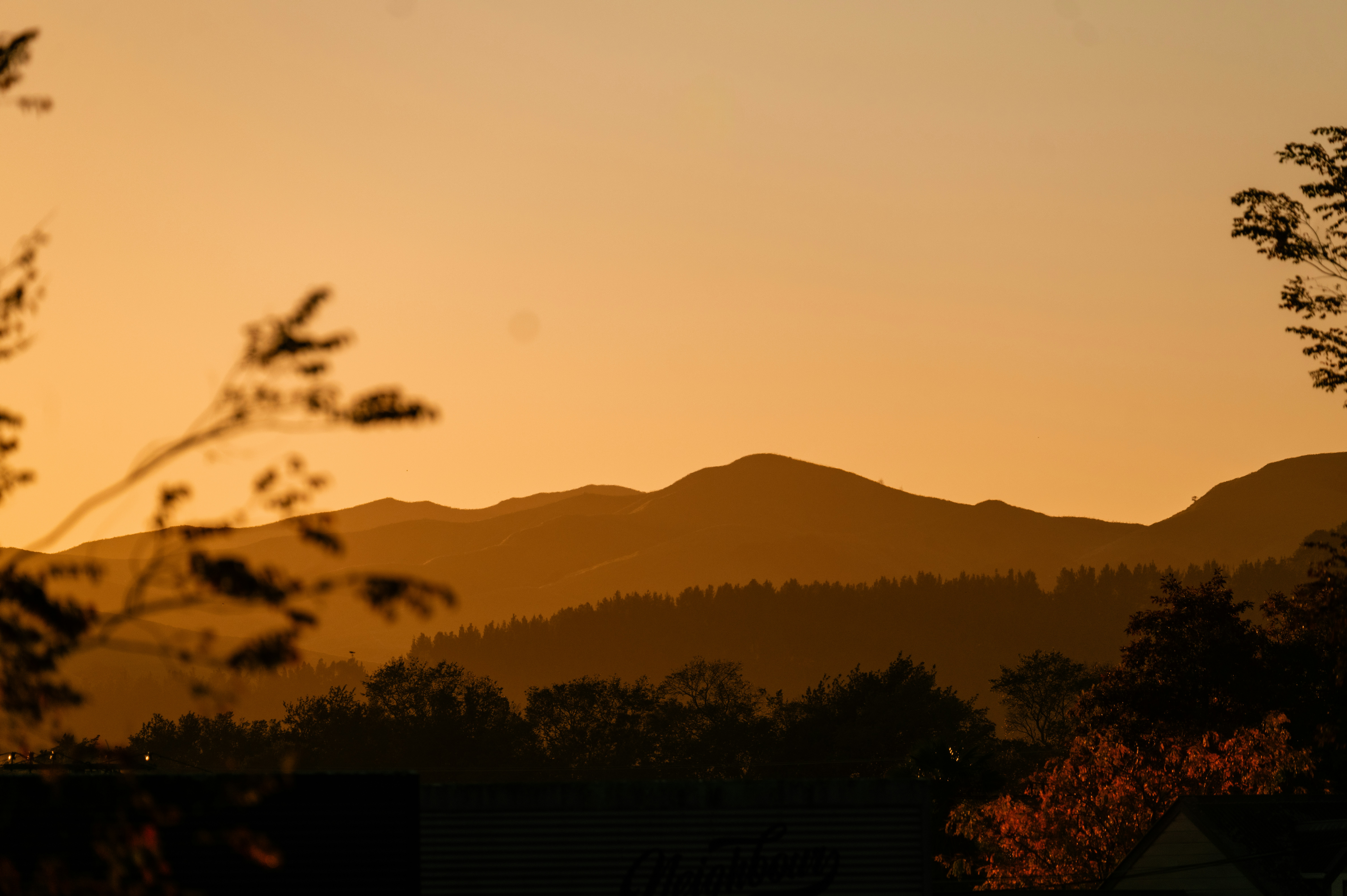 Horizon’s Quiet Amber: Dusk Over the Ridge