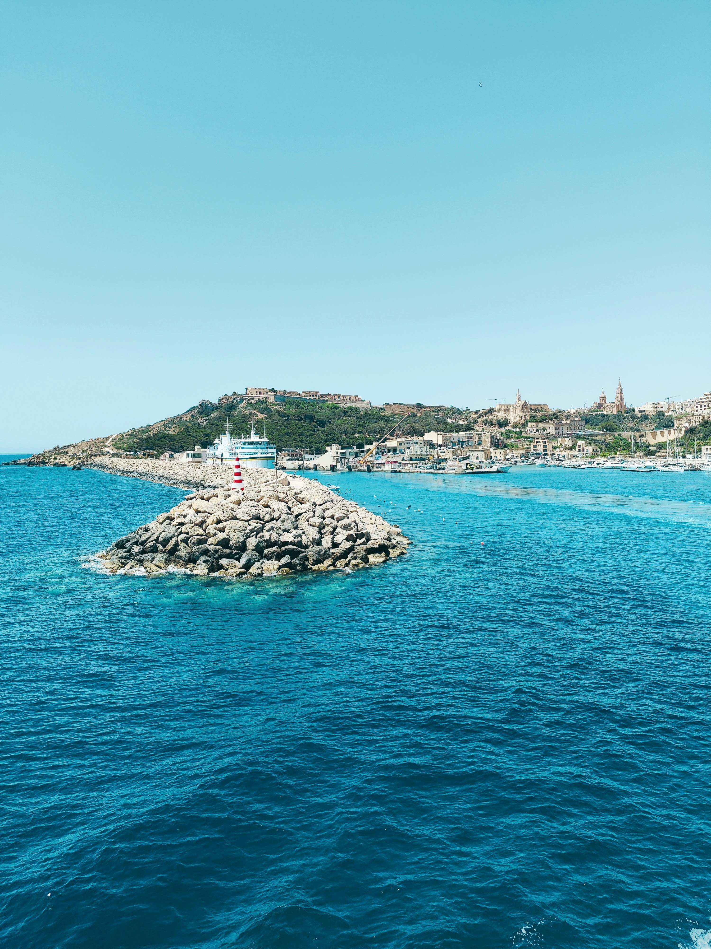 Coastal Breakwater Reaching Toward a Blue Horizon