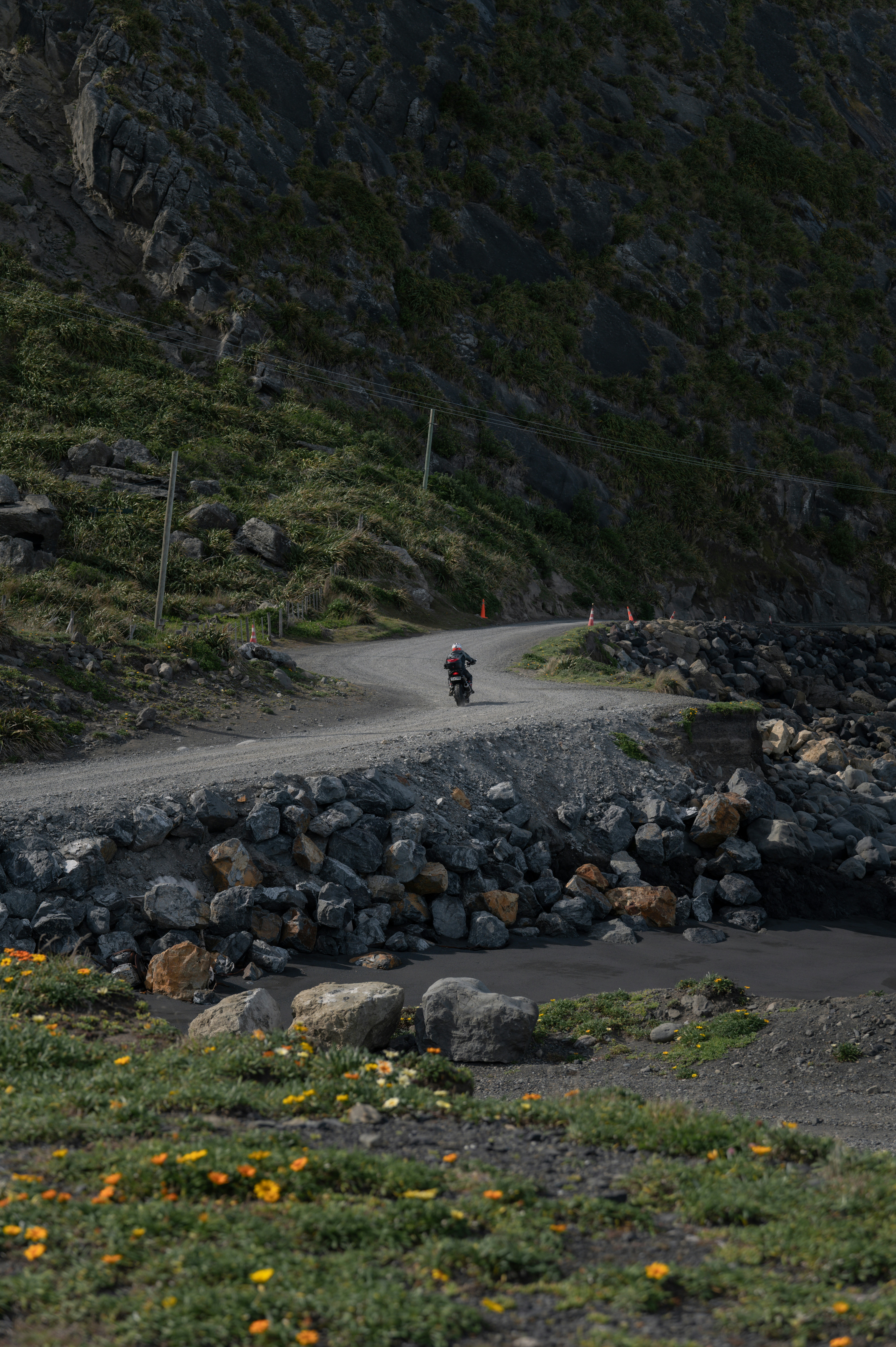 Serpentine Coastal Road: Rider on a Quiet Descent