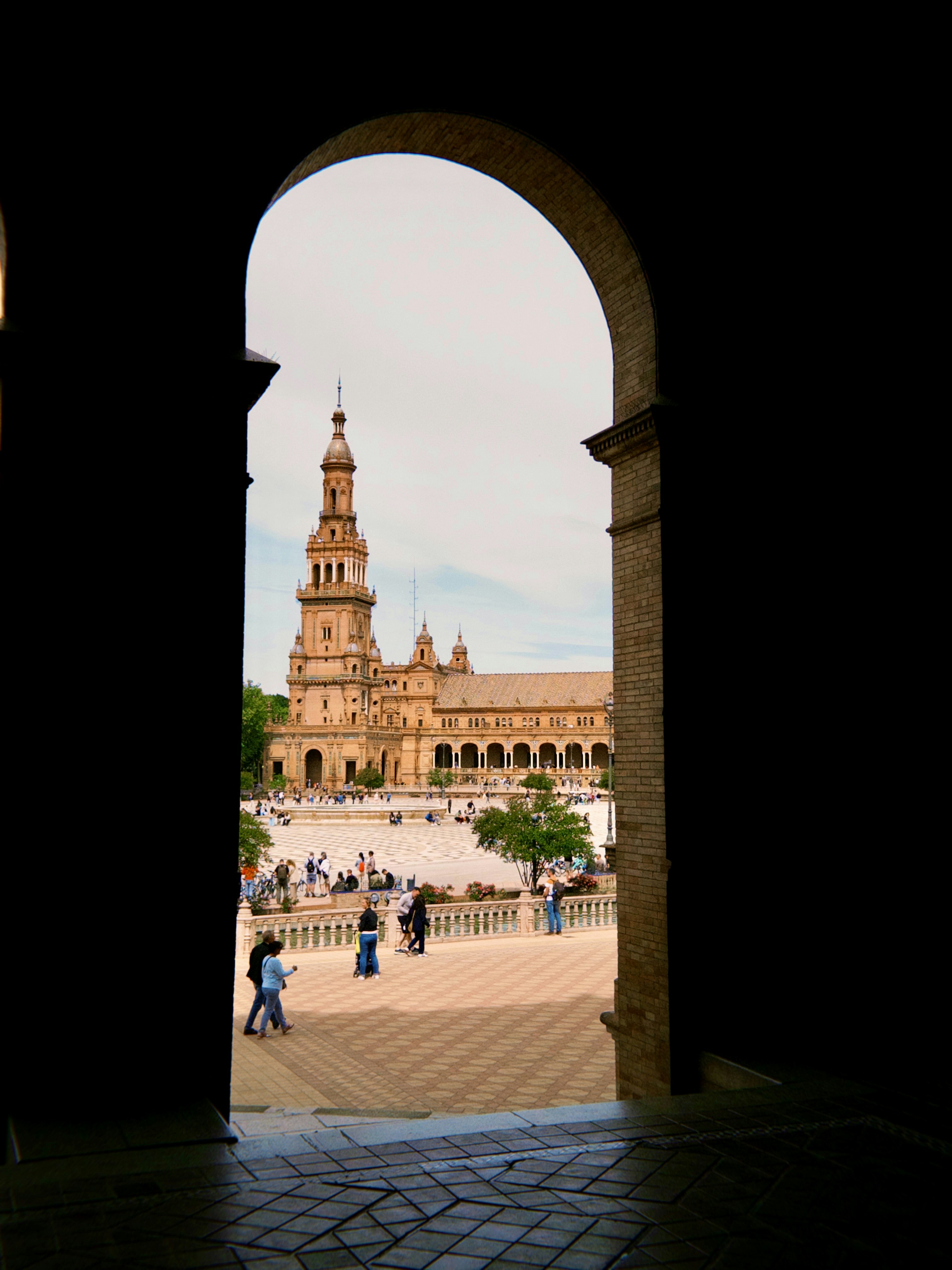 Through the Arch to a Sunlit Plaza