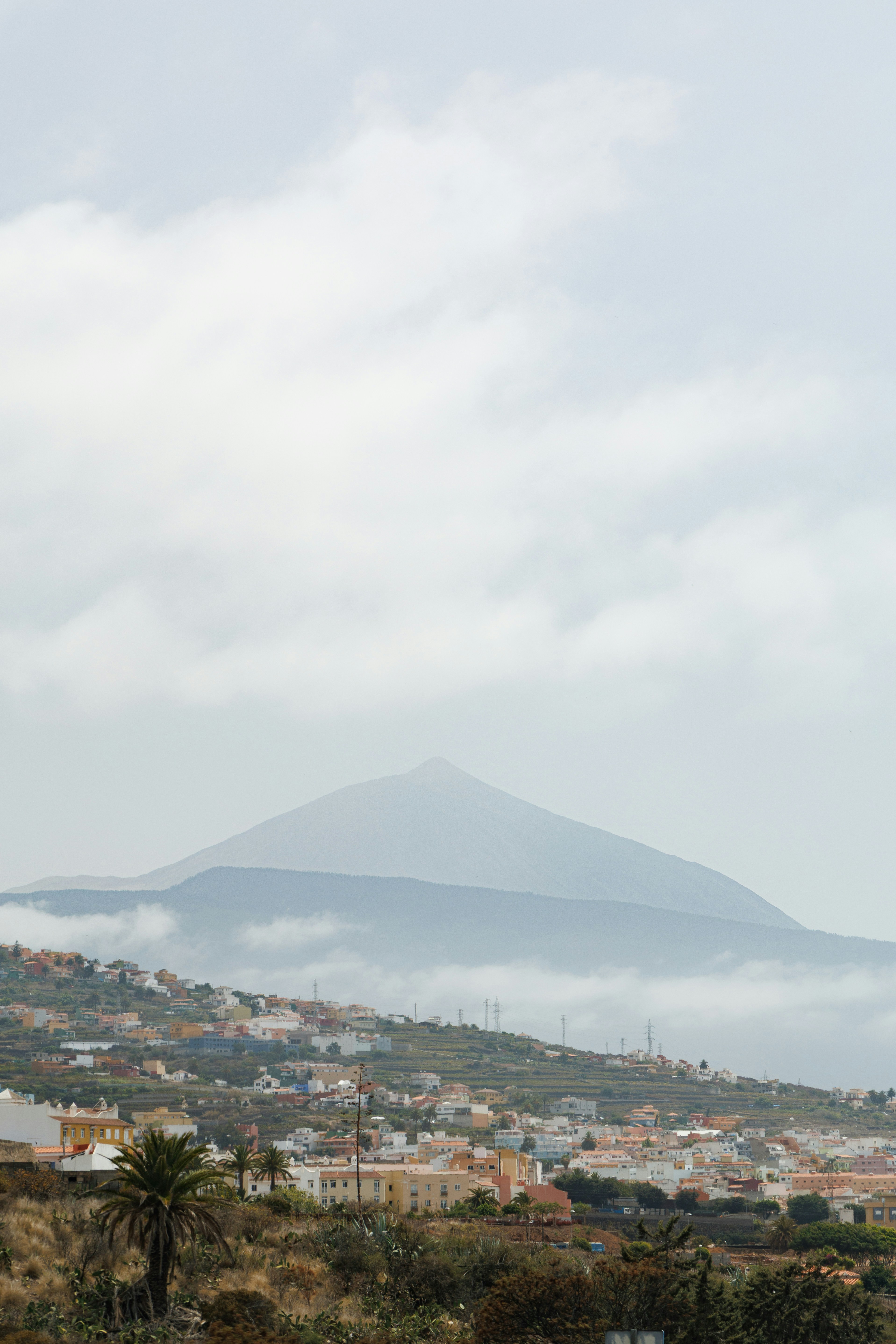 Volcanic silhouette over coastal townset