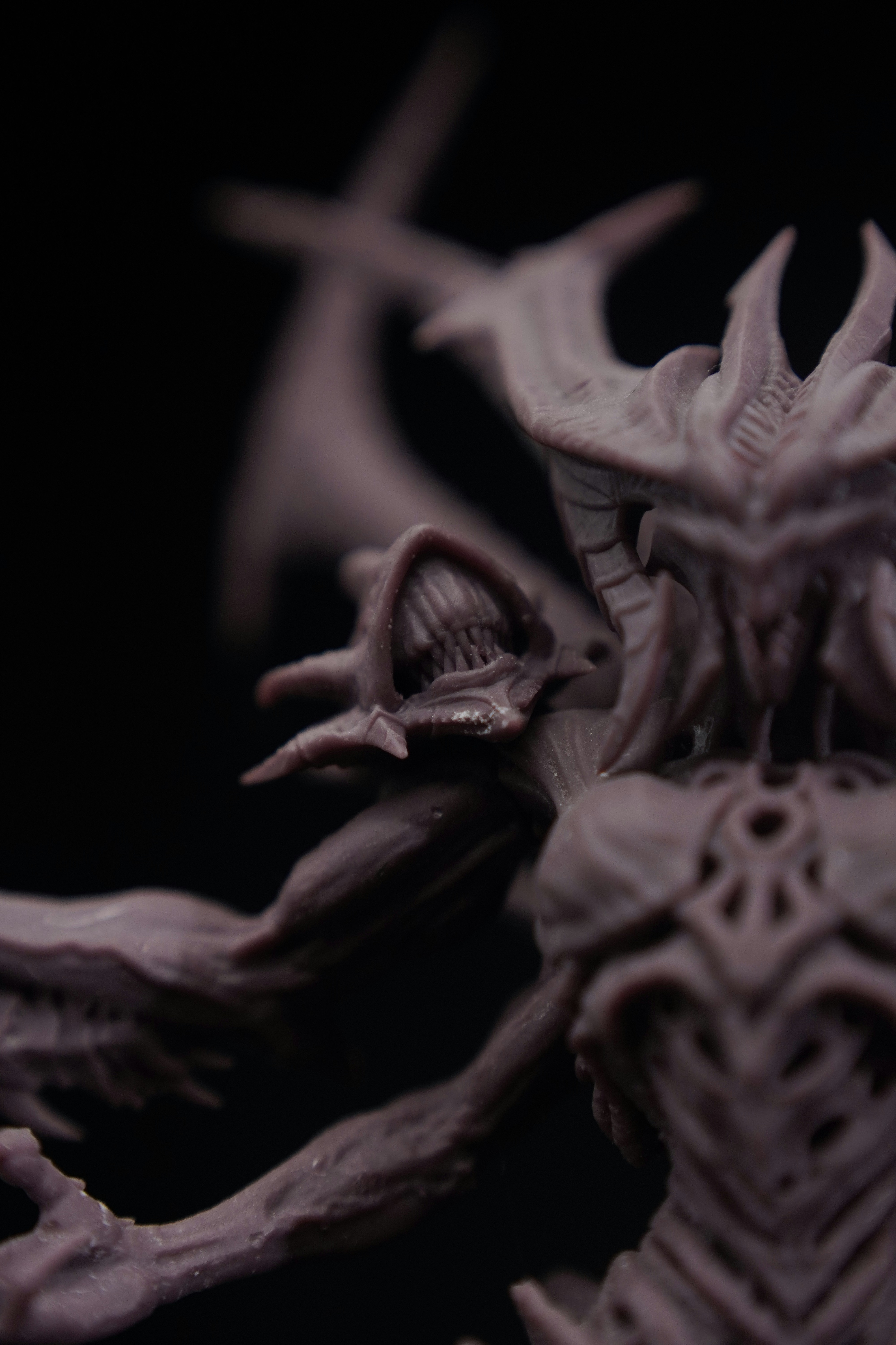 Dark Nectar: Macro Silhouette of a Pale Coral-like Sculpture