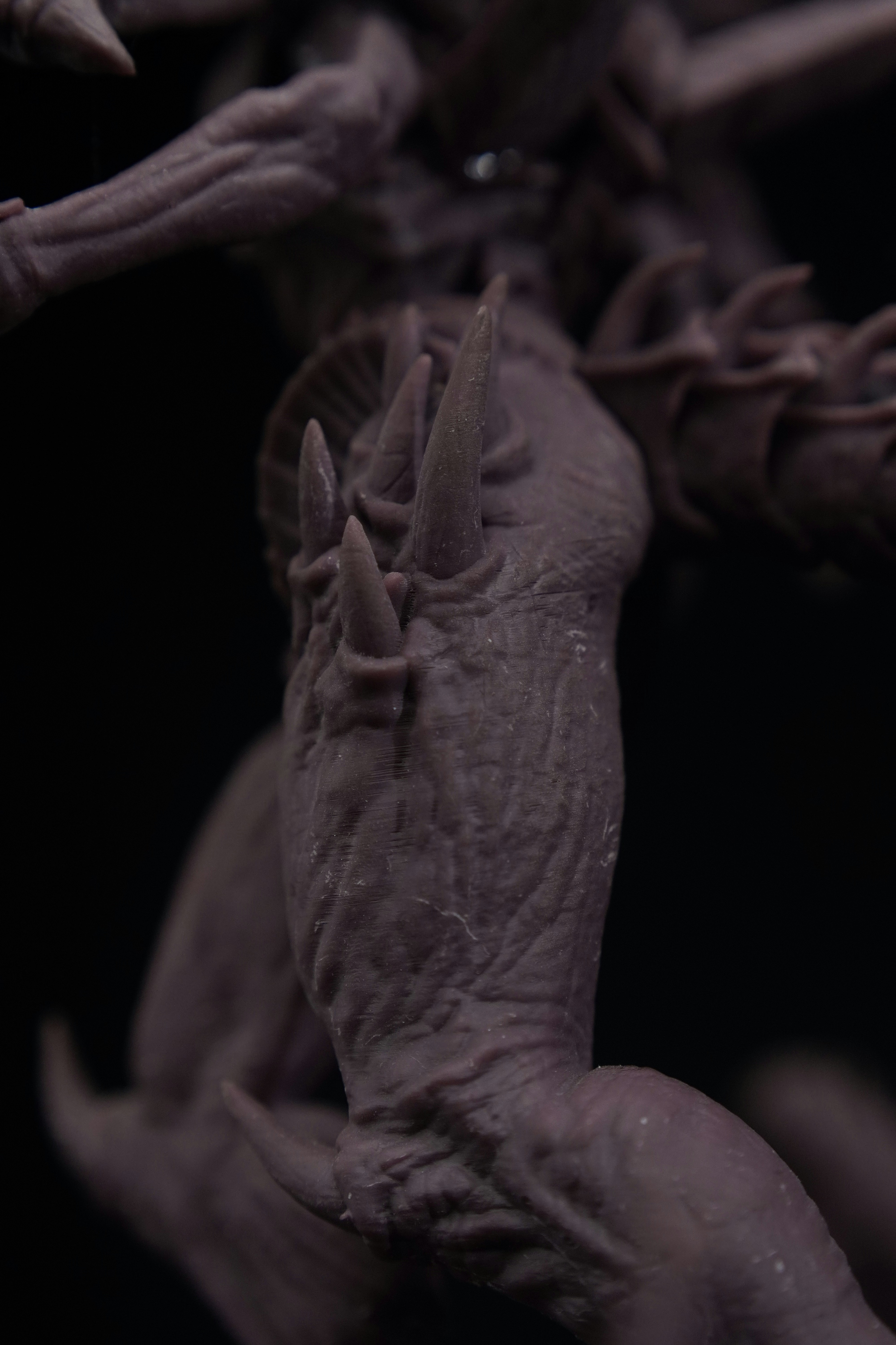 Dark Veins of the Abyss: A Close-Up on Ancient, Armored Fangs