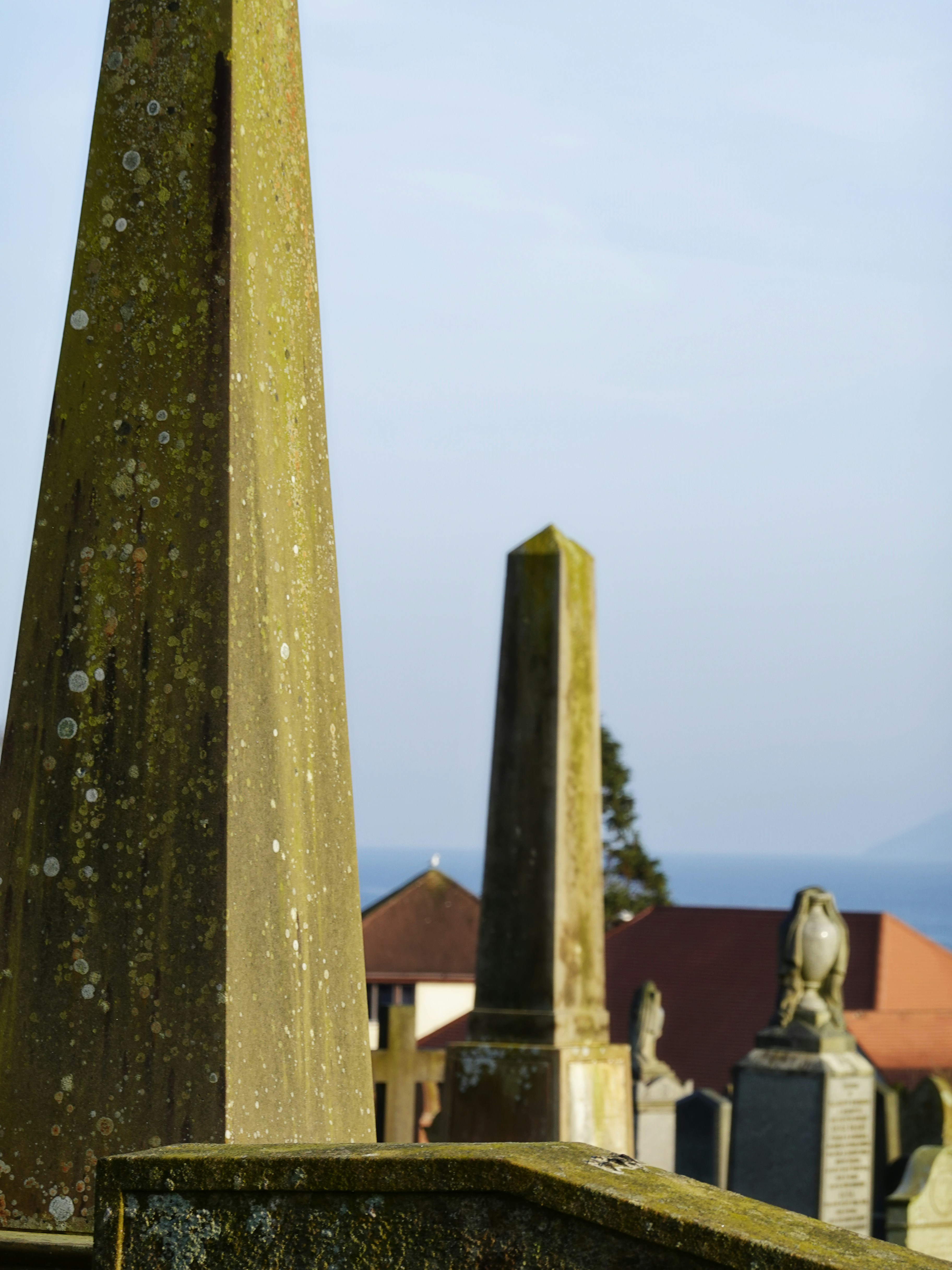 Weathered Obelisks Against a Distant Sea Horizon