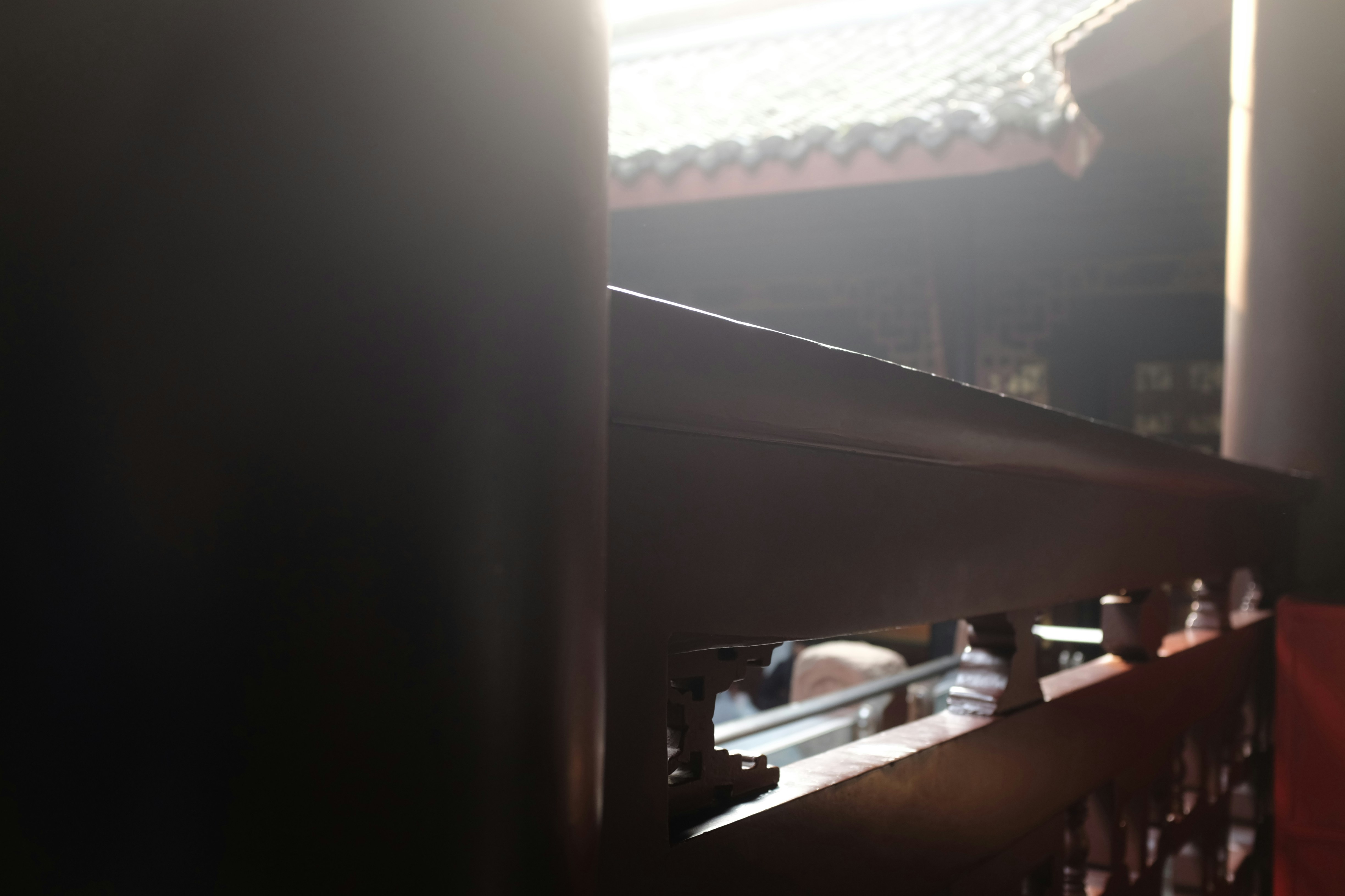 Red Gate, Quiet Railings: A Moment Through the Balustrade