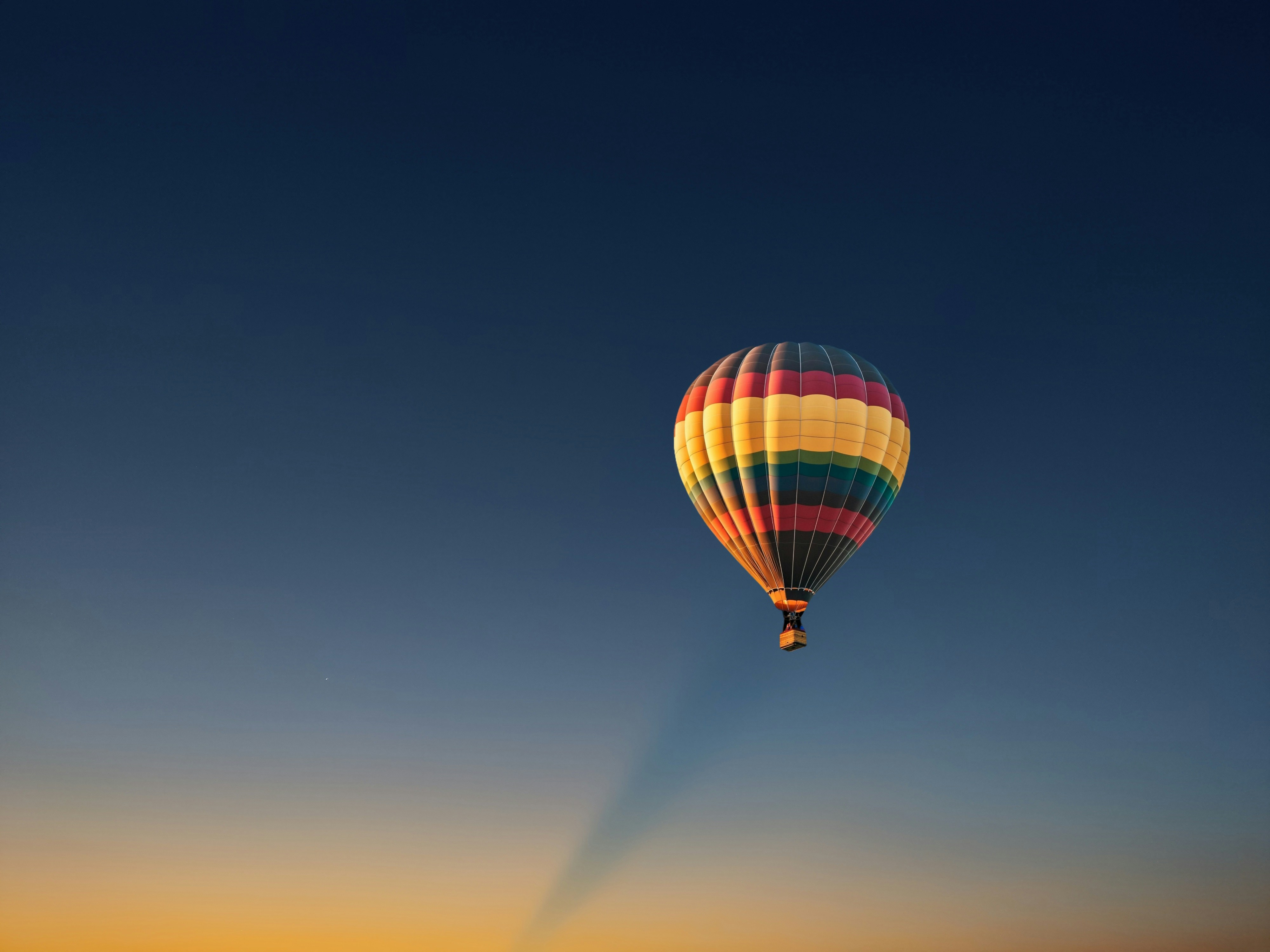 Balloon Ascend: A Solo Rainbow Drift Over Dusk Horizon