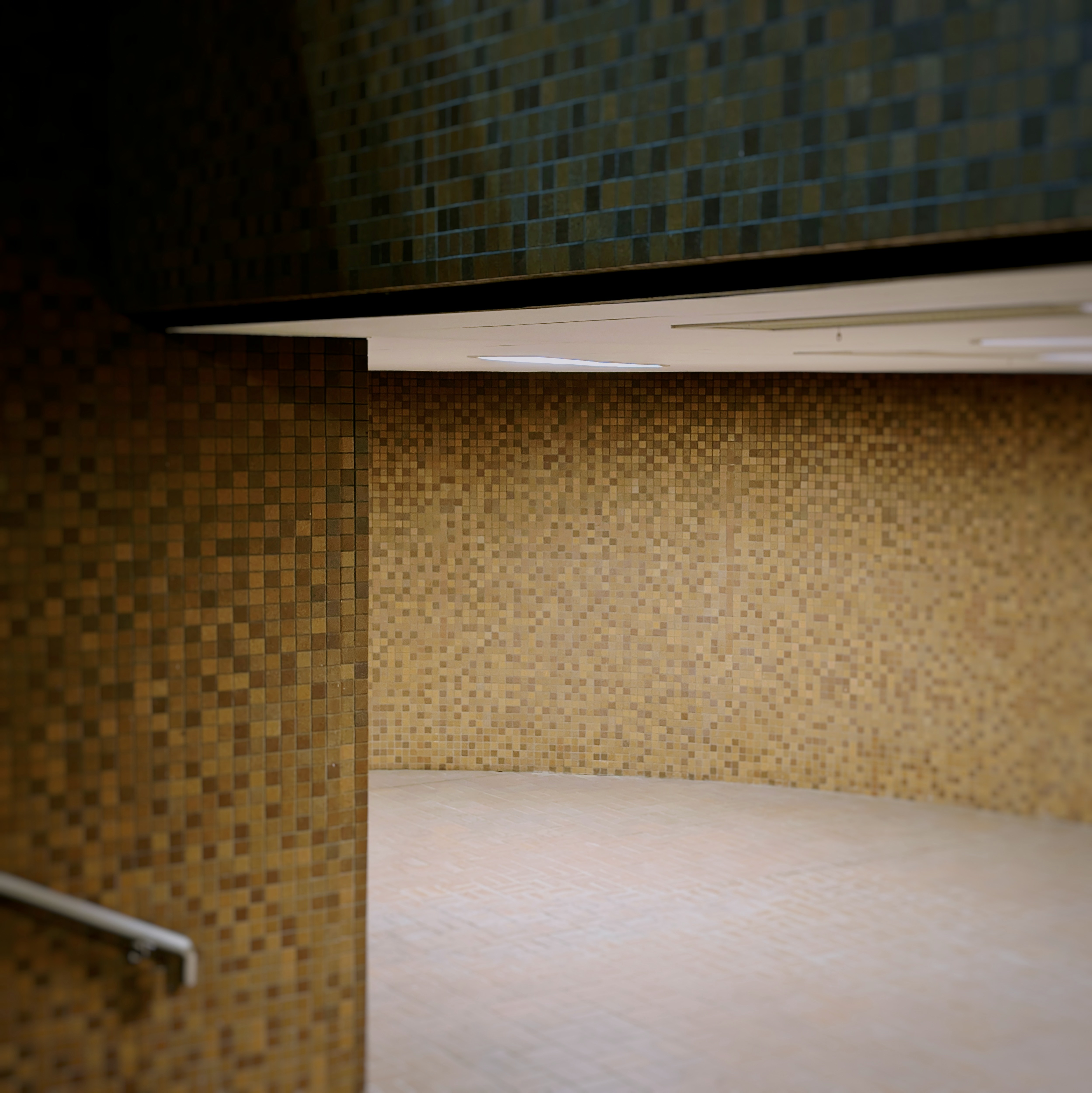 Curved Mosaic Corridor: Light, Texture, and Depth