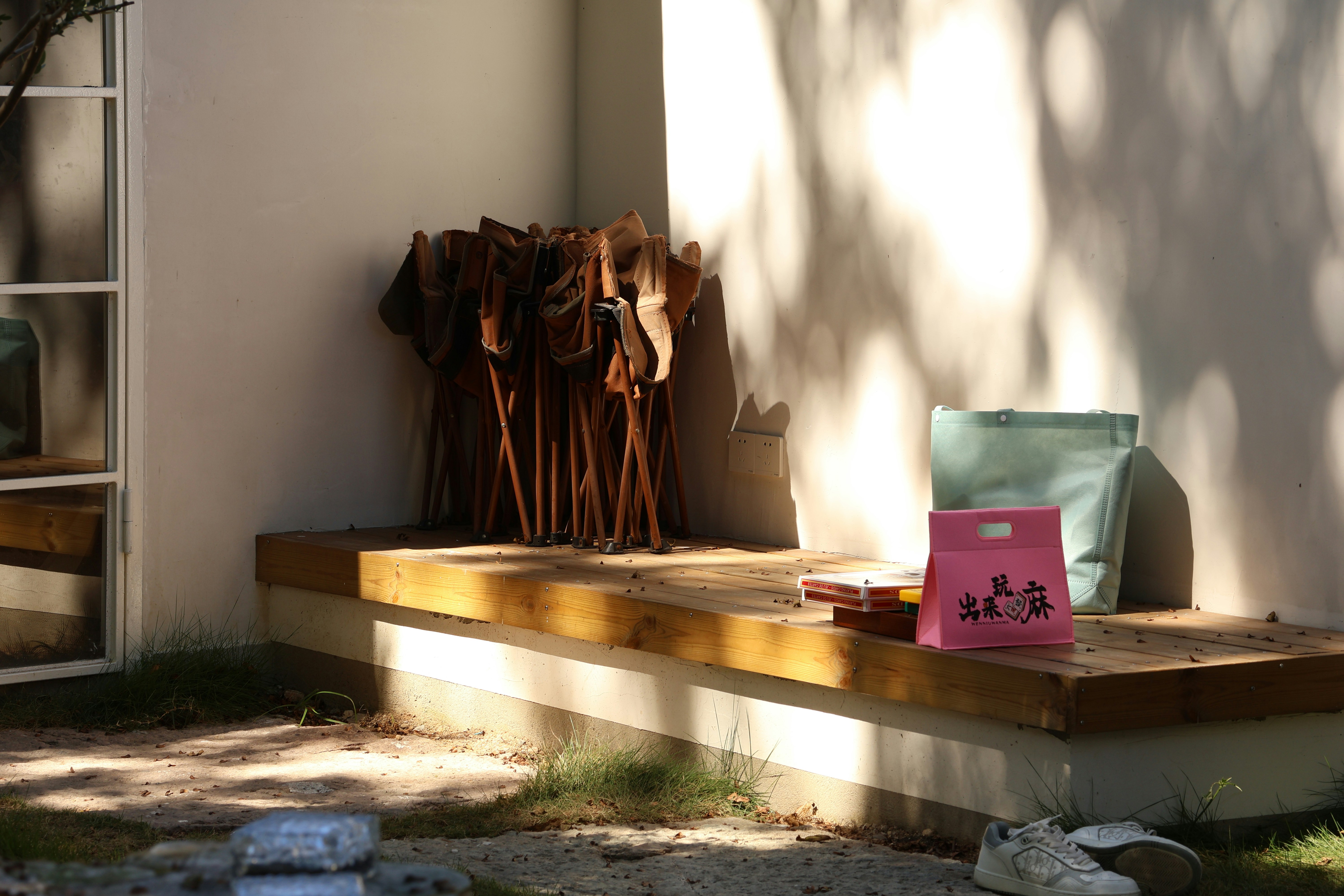 Sunlit Bench of Boots and Boxes