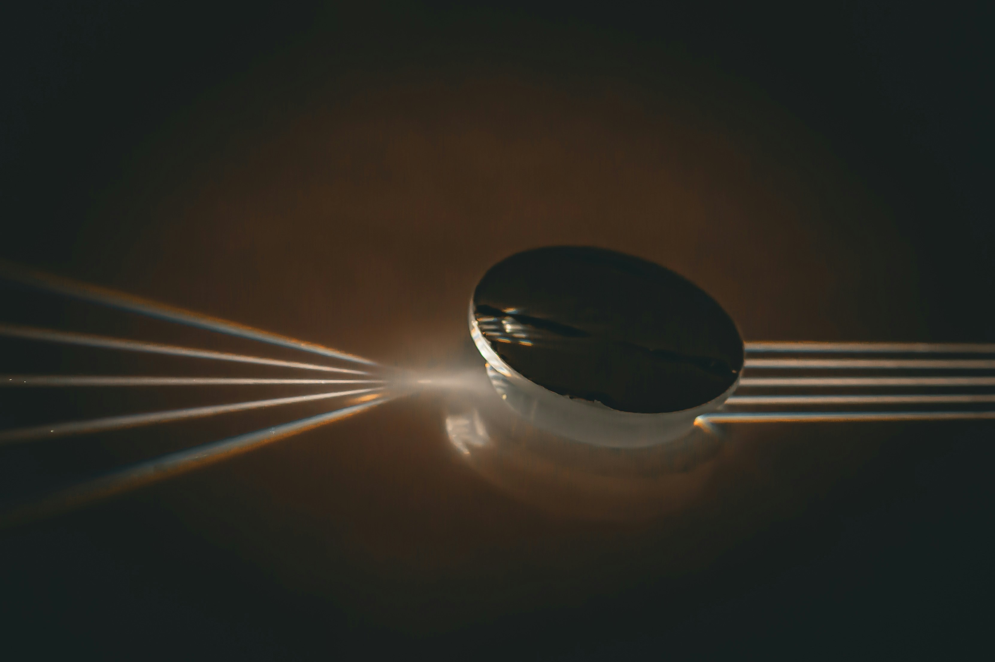 Silvery Orb and Converging Light Stripes