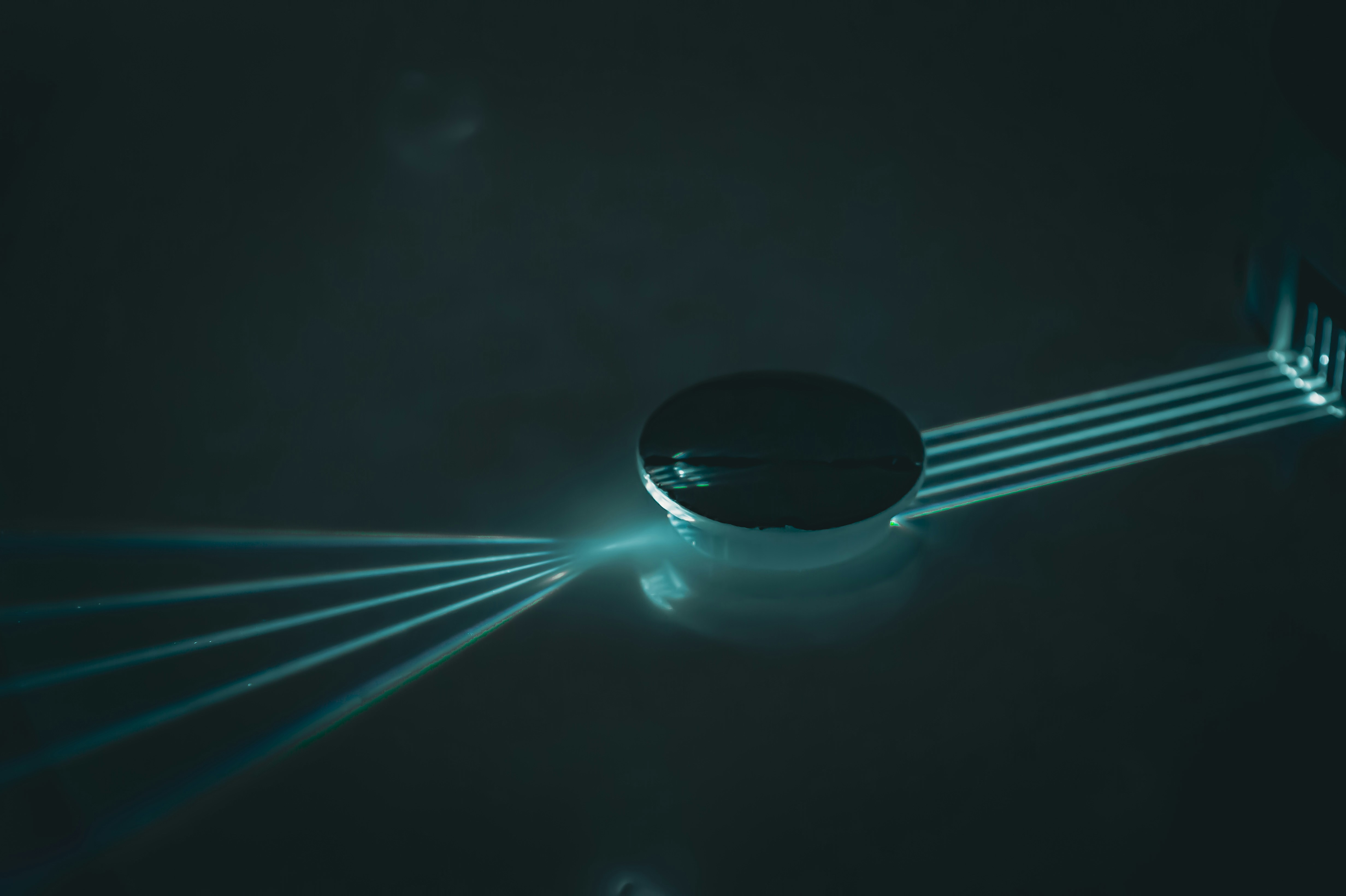 Orbital Needle: A Micro-Disc Casts Light Beneath Dark Water