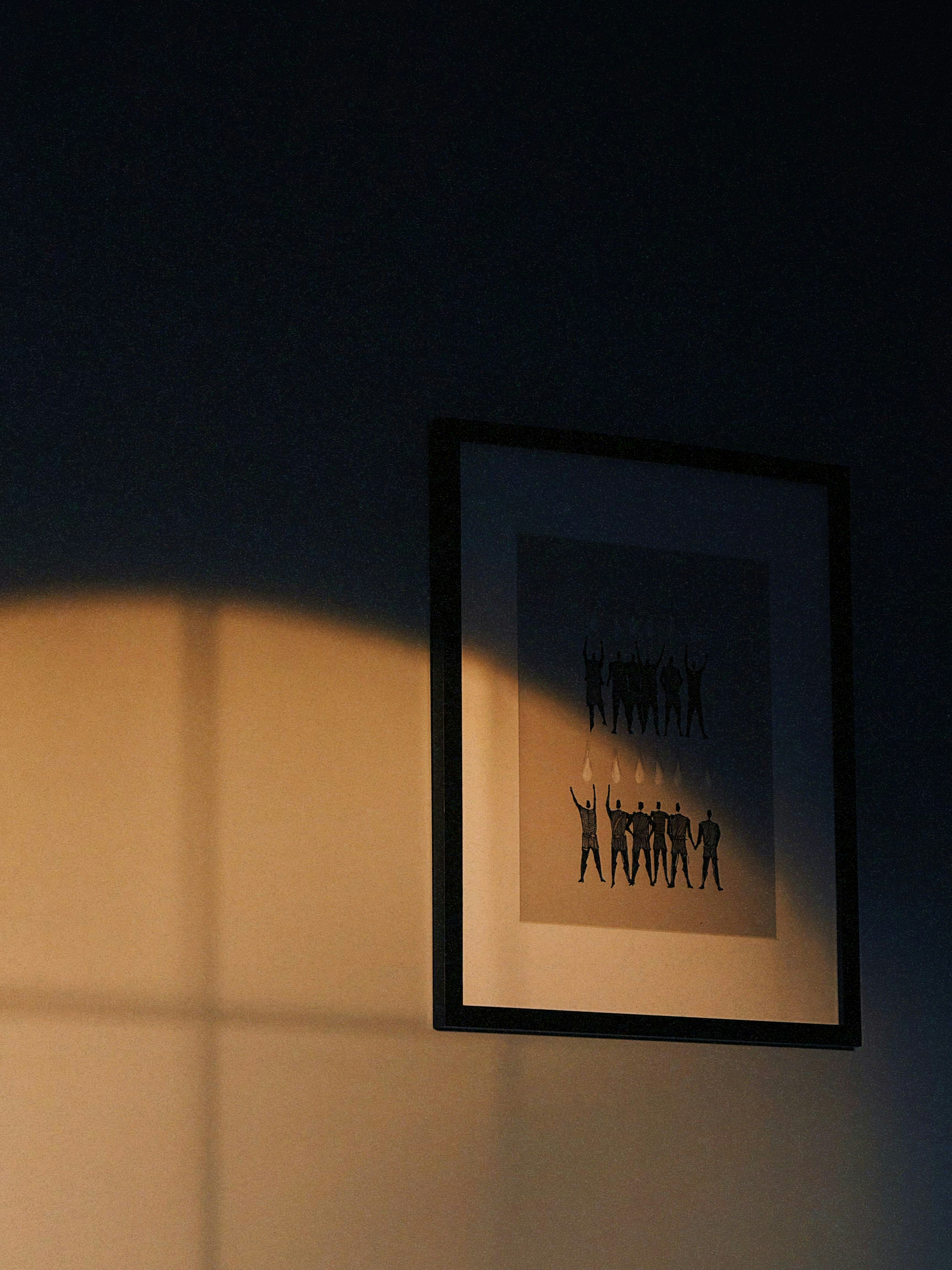 Shadowed Gallery: Framed silhouettes in warm dusk light