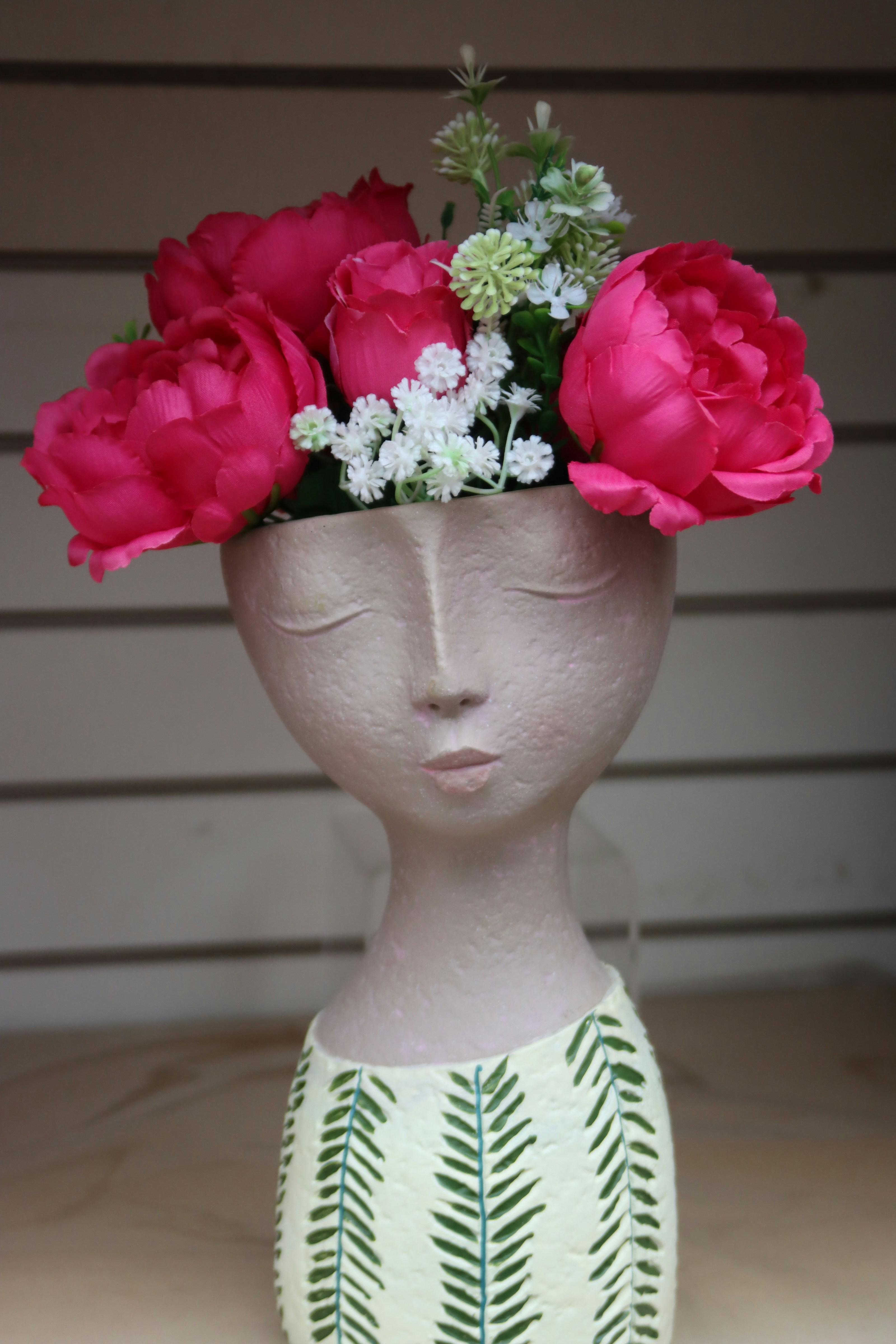 Headpiece of Blooms: A Ceramic Vase with Pink Peonies as a Living Crown