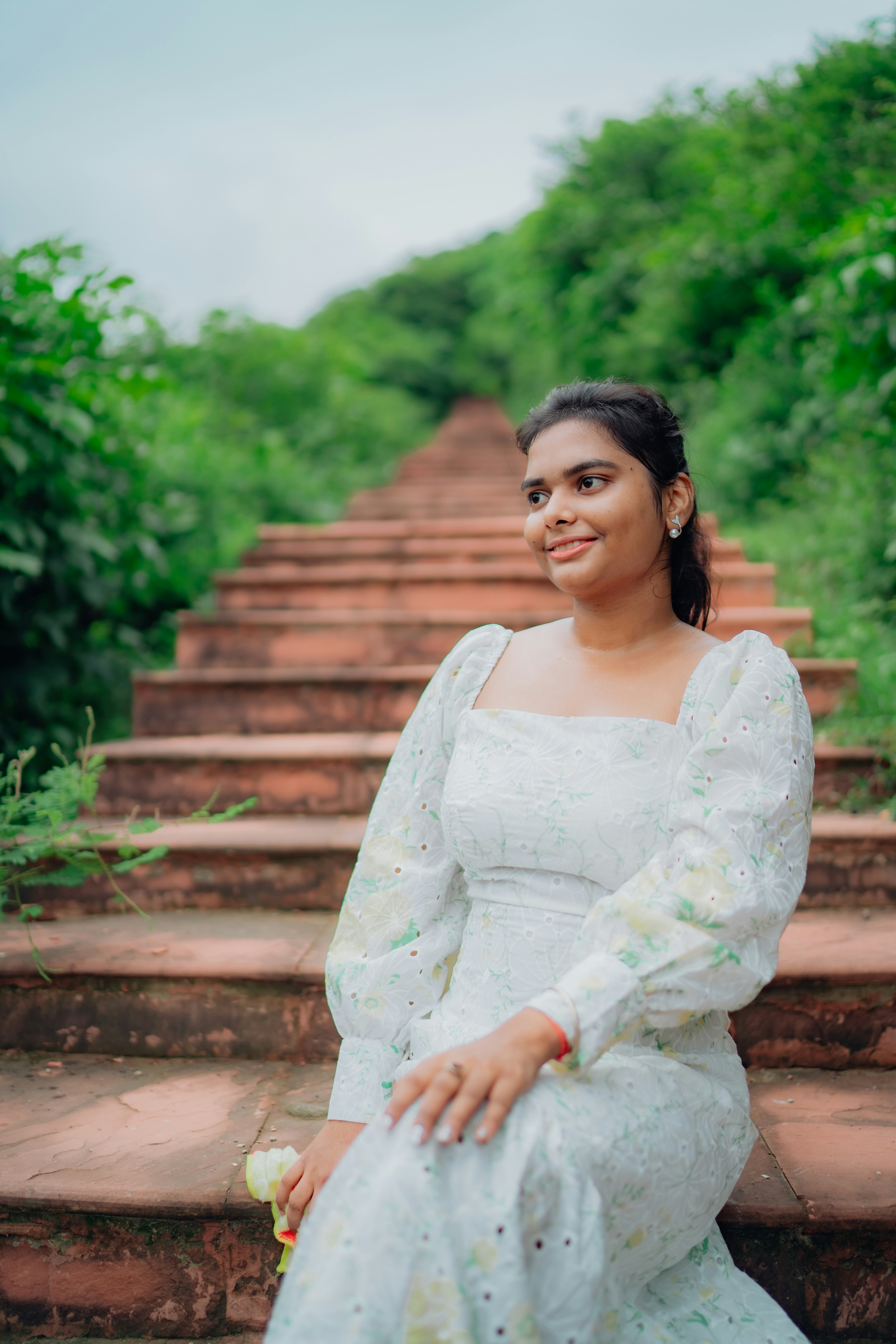 Grace on the Steps: A Quiet Portrait in White