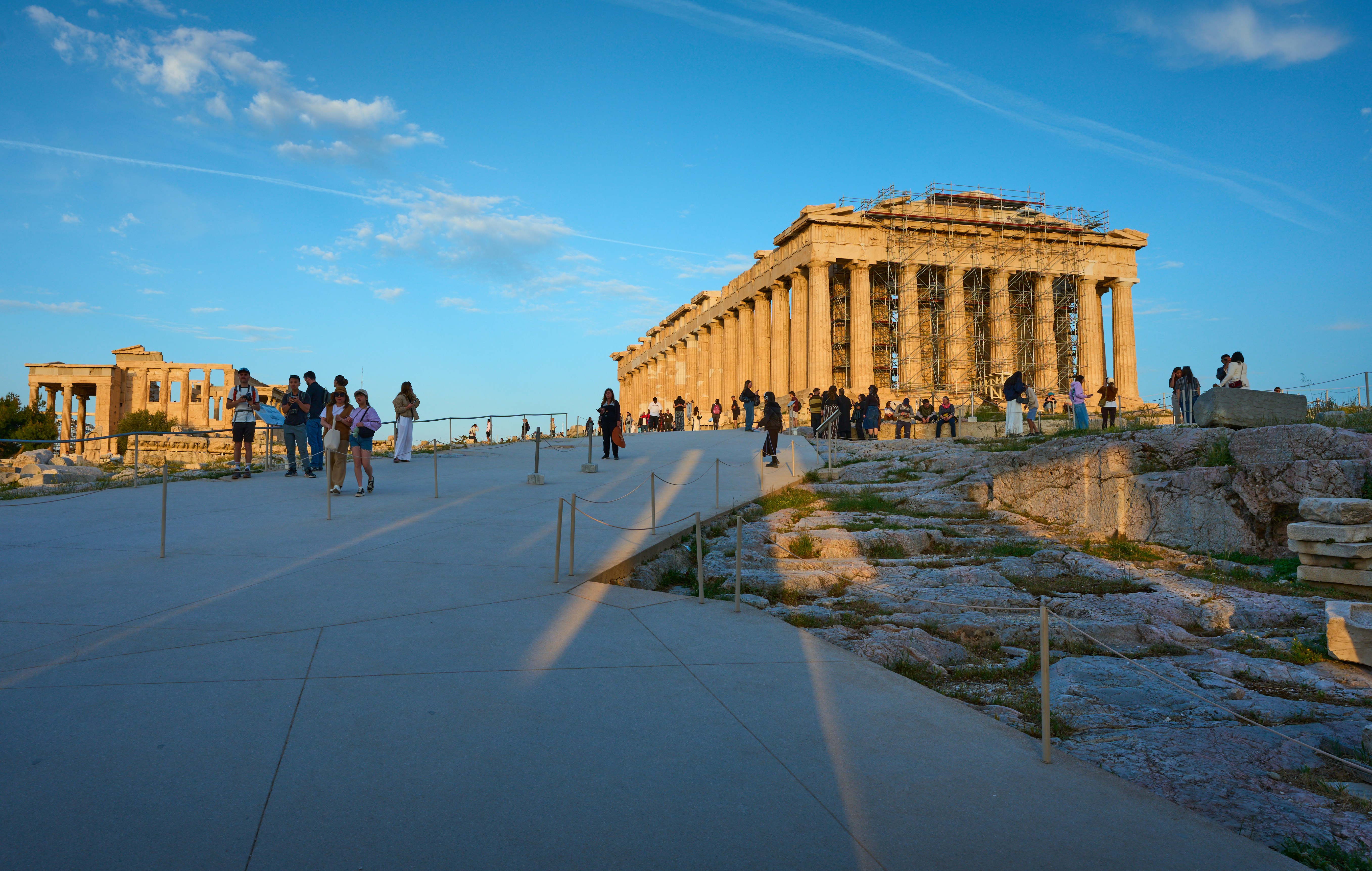 Golden Temple Steps: Visitors at the Acropolis of Athens