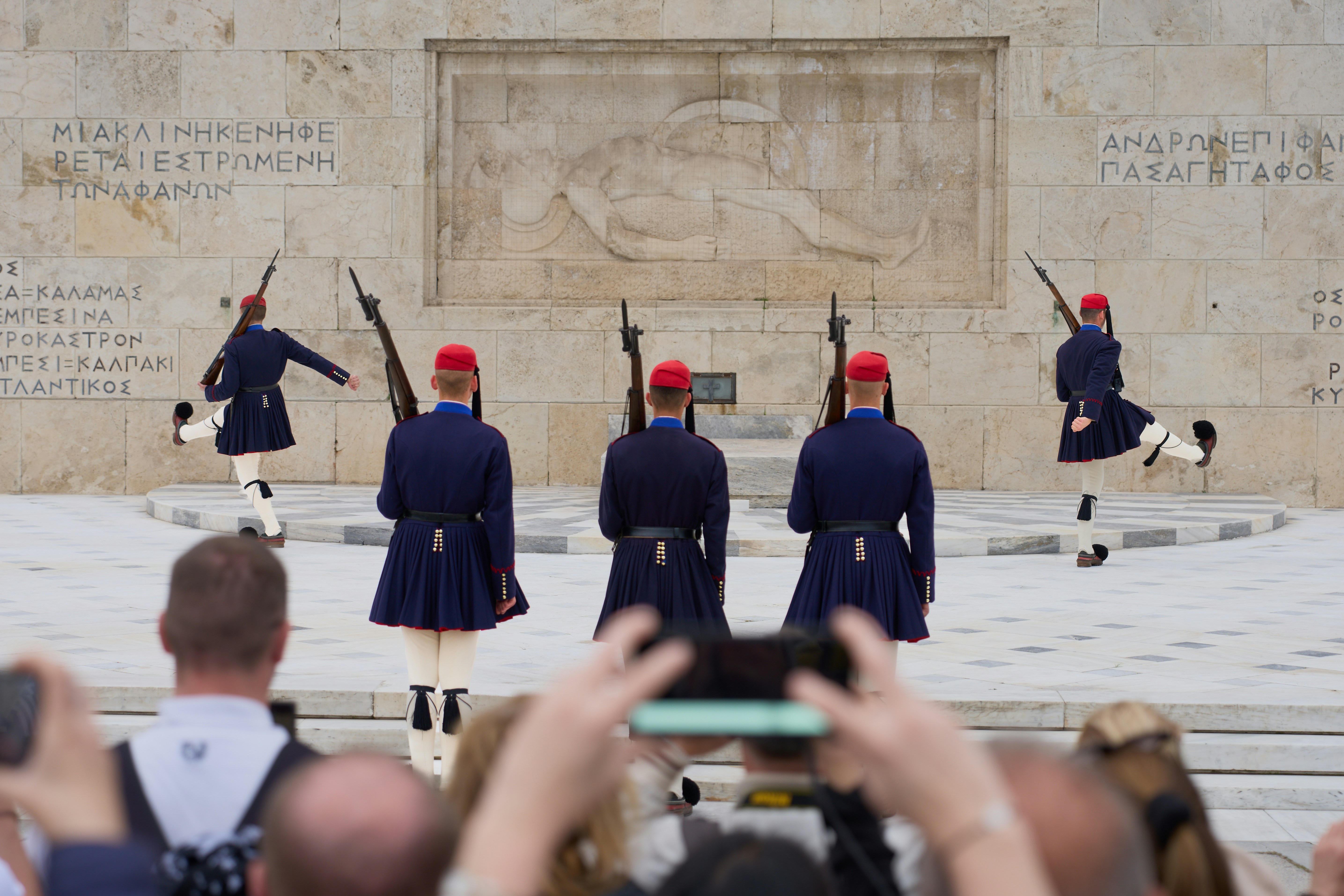 Ceremonial Guards in Front of a Monument: A Crowd Captures the Moment