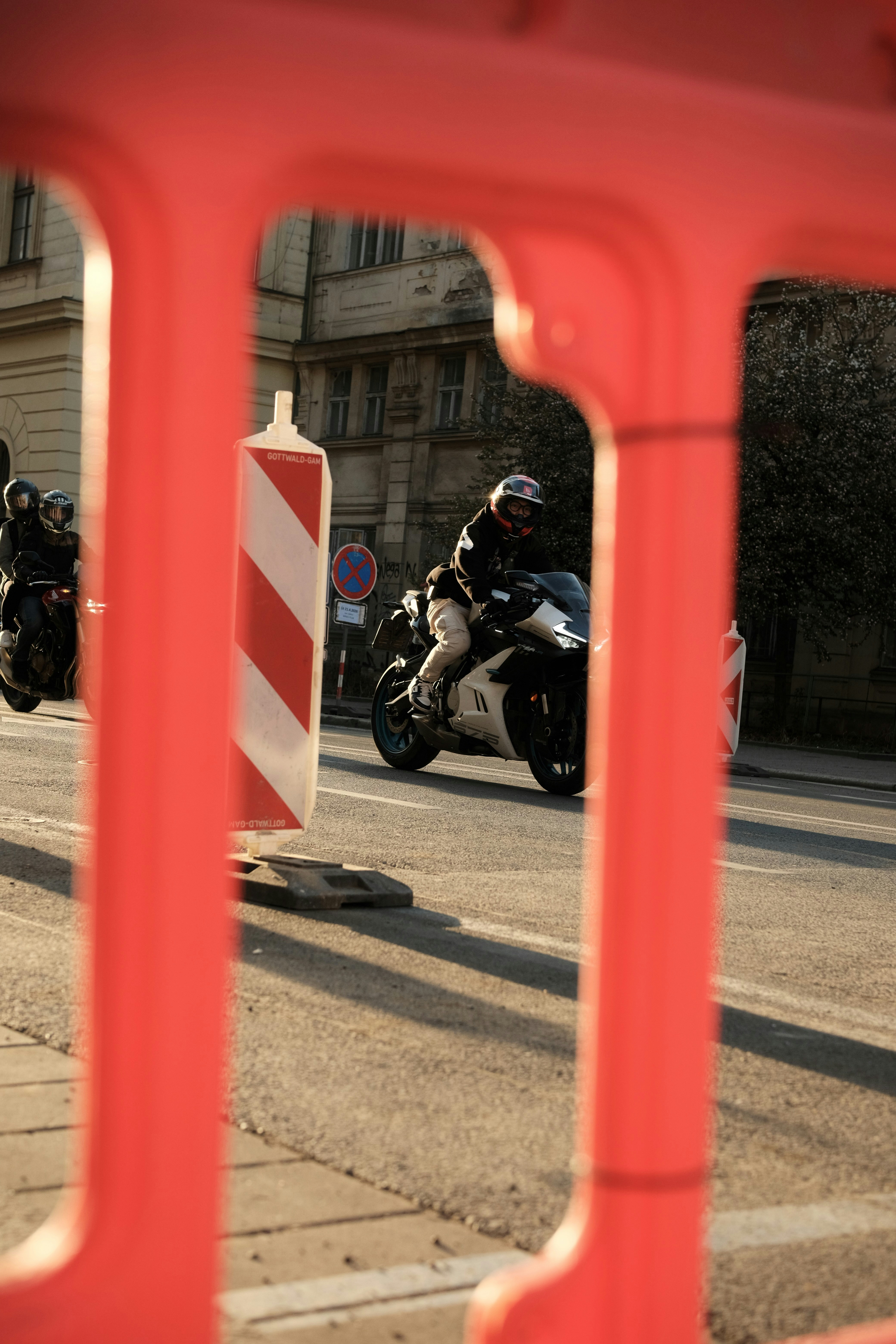 Neon Barriers Framing a Street Ride