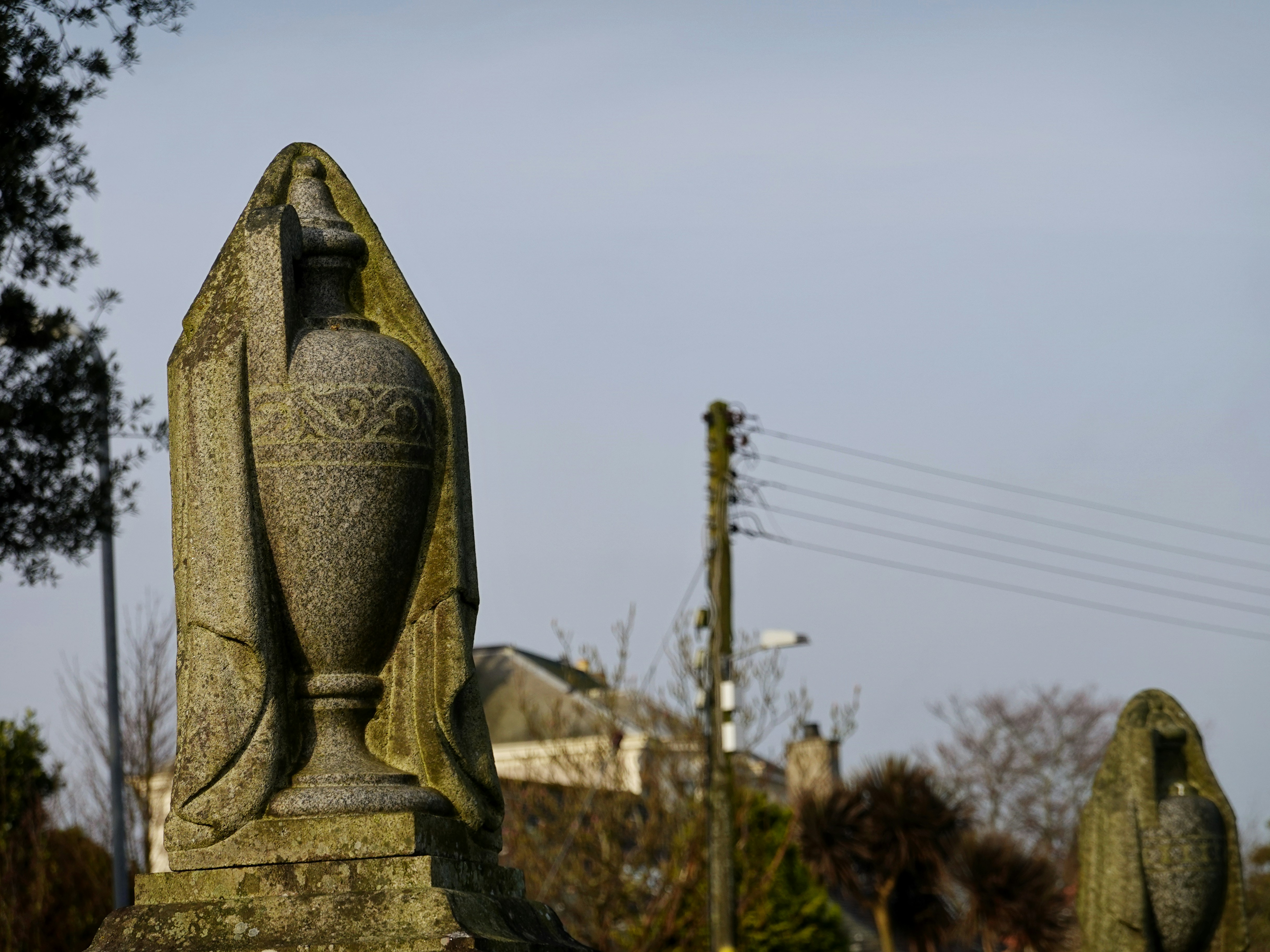 Stone Urn Monument Rising Above Quiet Street