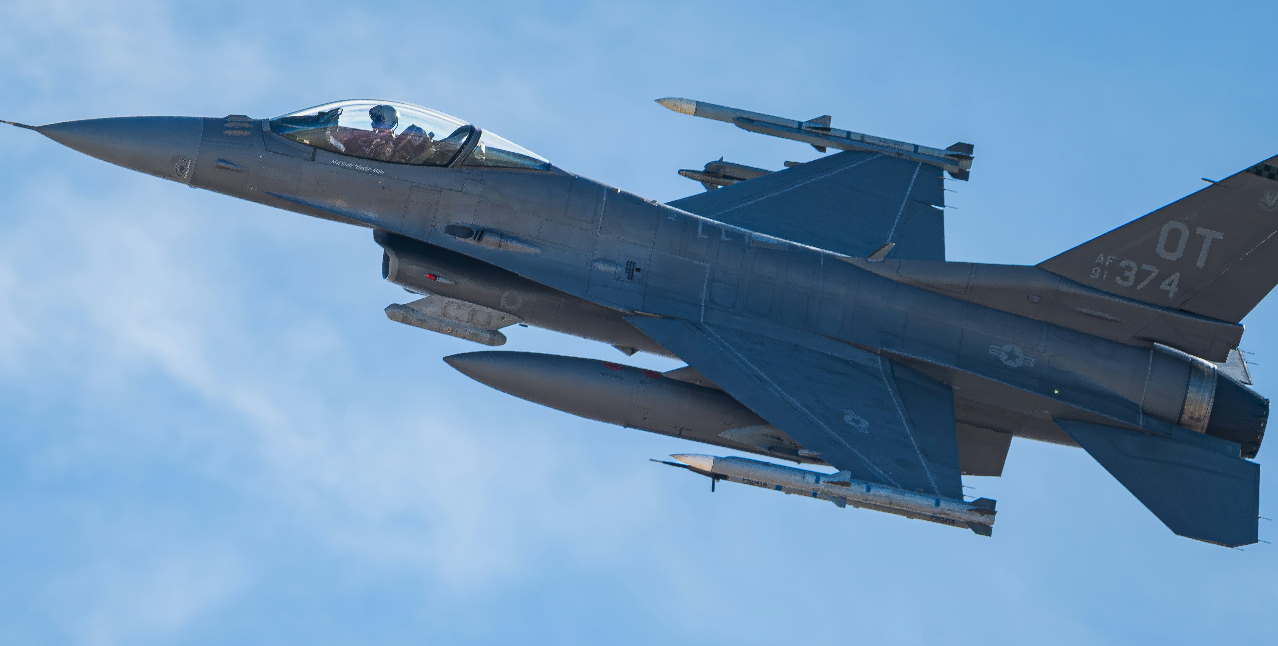 Jet in Pursuit: A low-angle pass under a blue sky