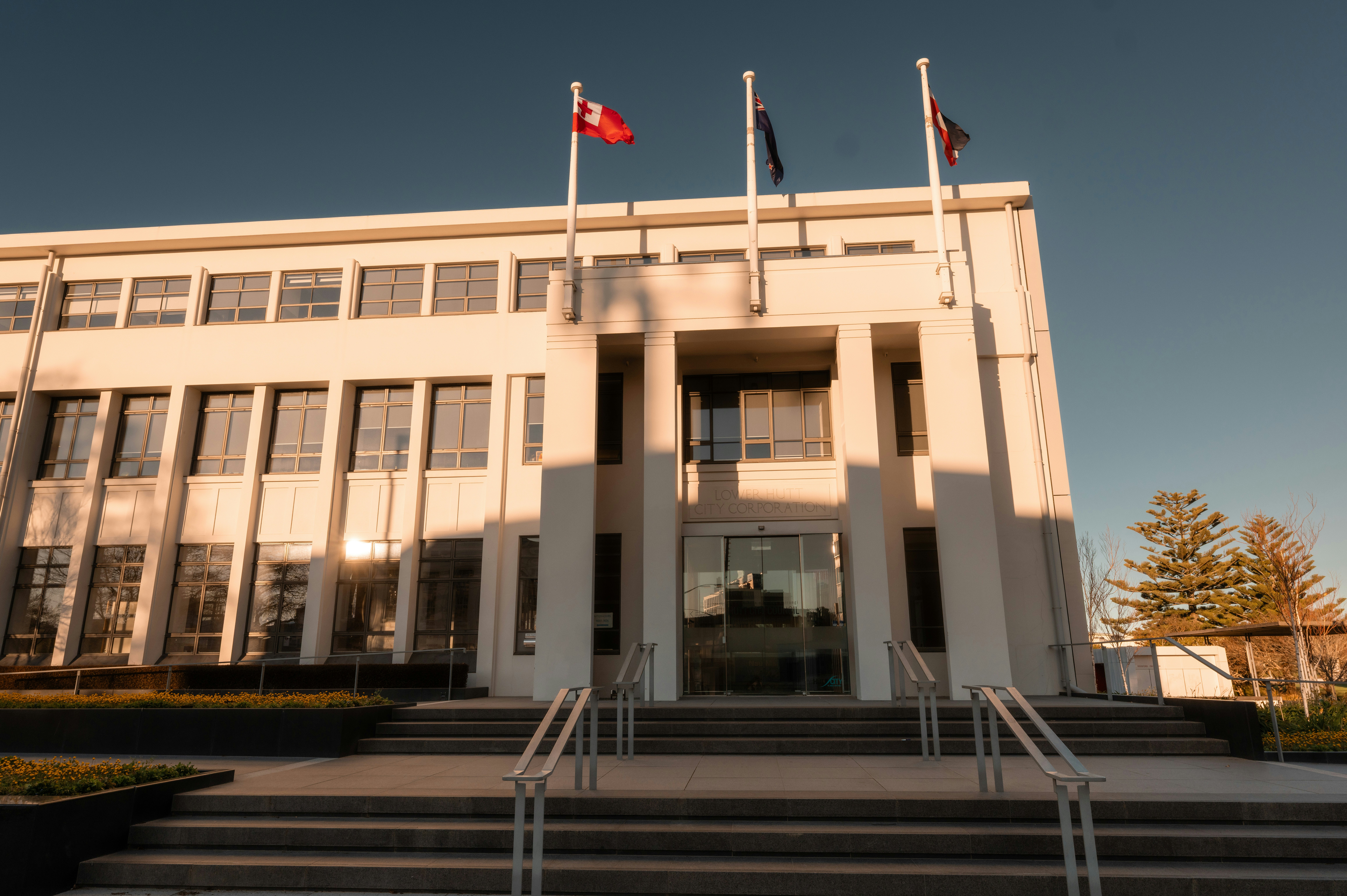 Stately Federal Facade: Steps, Symmetry, and Flagpoles