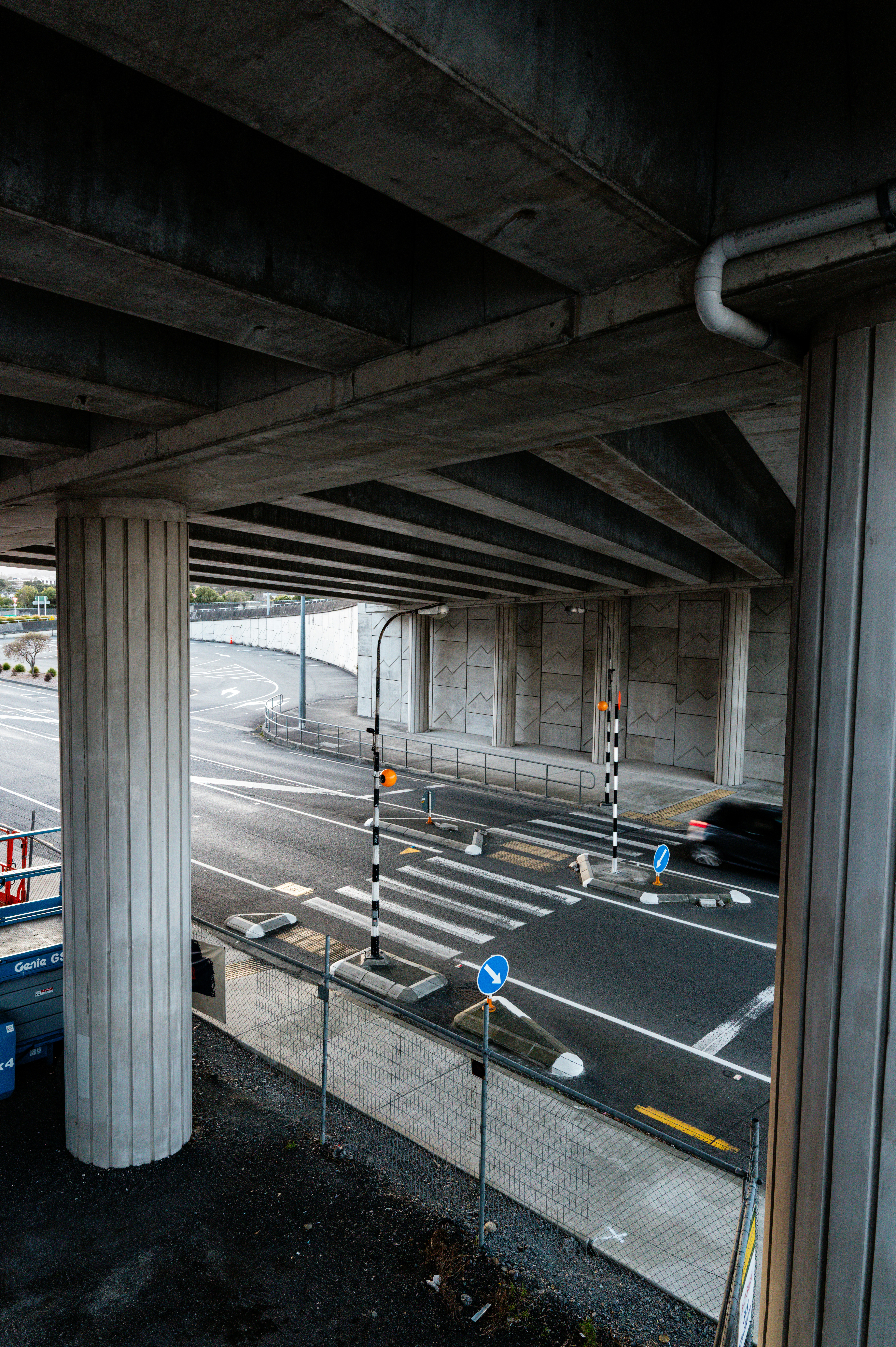 Overpass Corridor: A Quiet Urban Intersection Under Concrete Giants