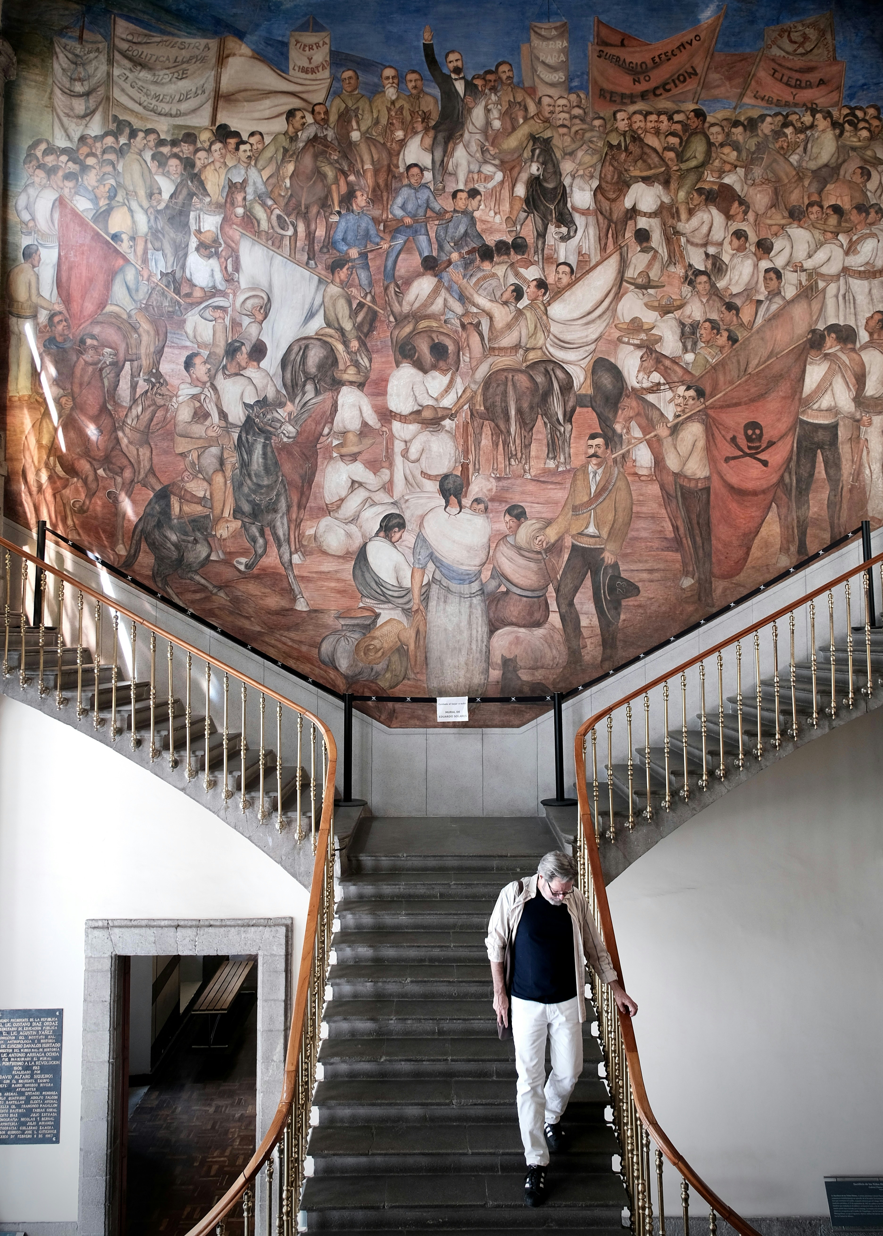 Staircase Reverie Under a Historic Mural