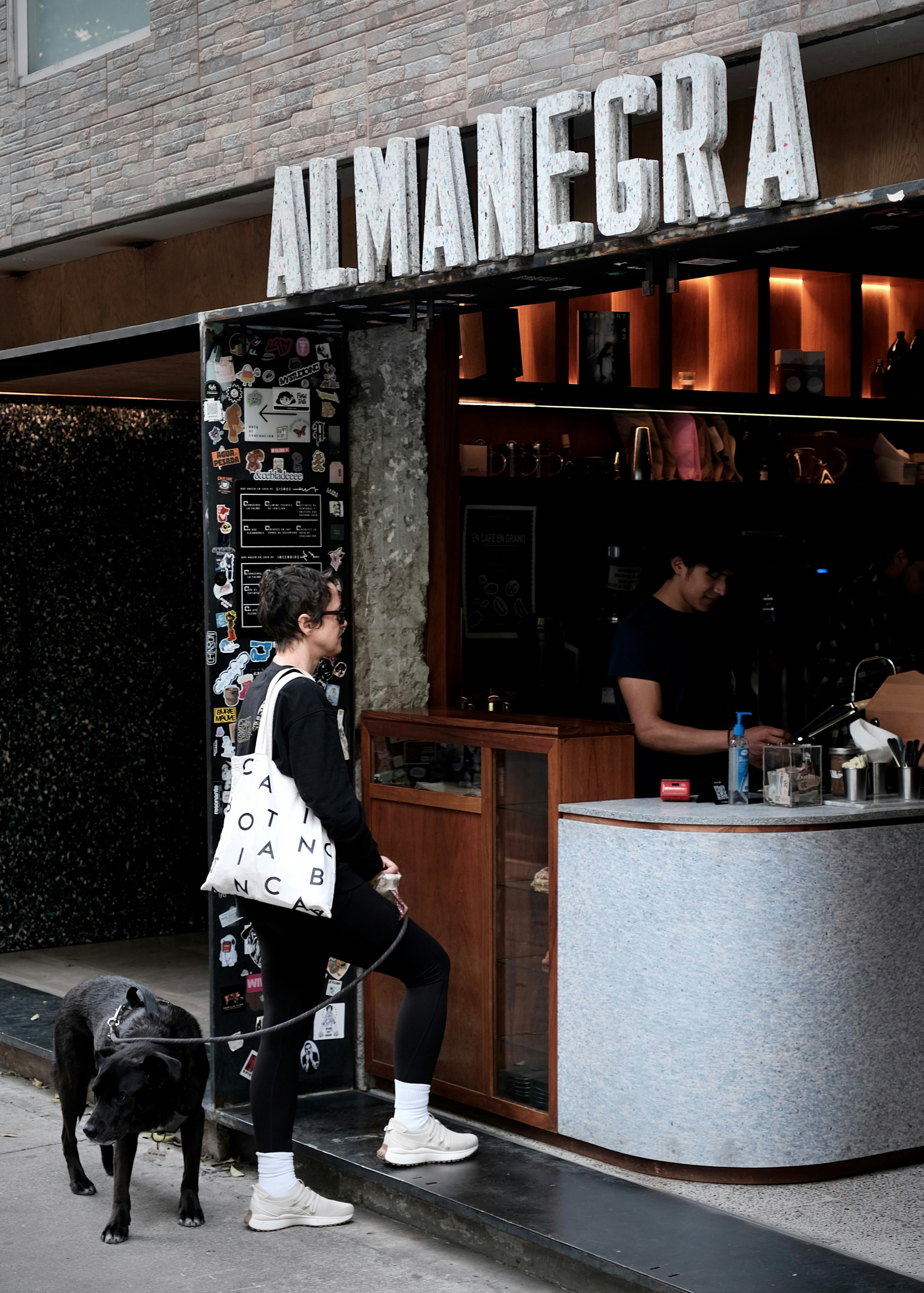 City Pedestrian Meets the Bar: A Quiet Exchange by ALMANEGRA