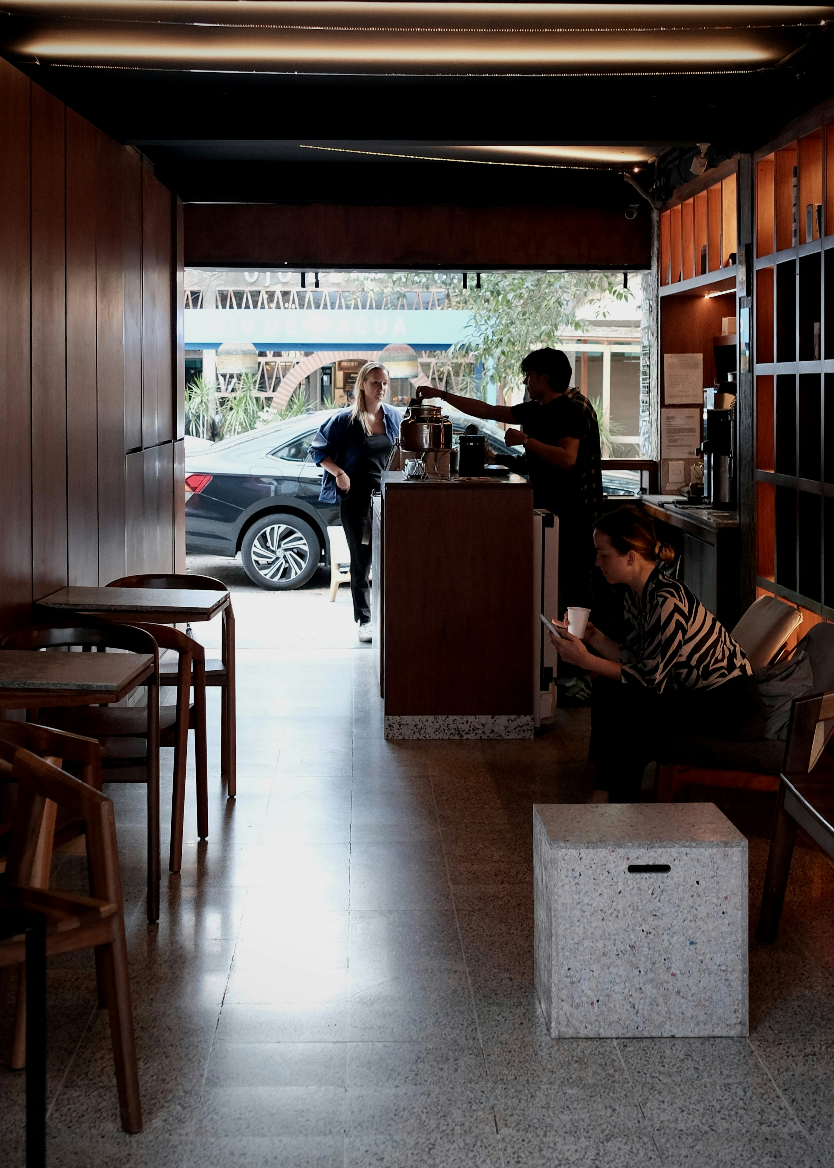 Cafe Barista and Customer in a Quiet Morning Interlude
