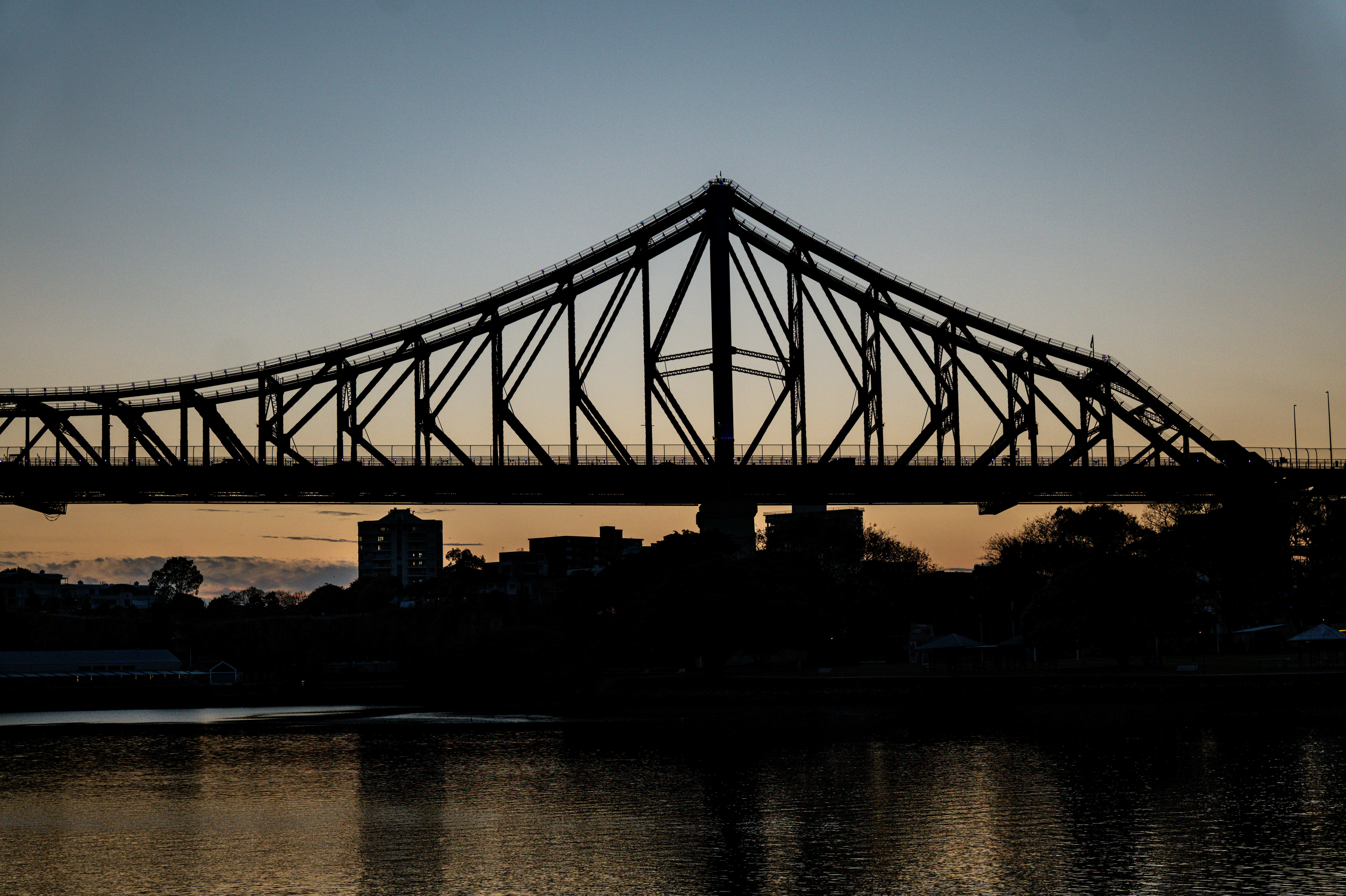 Silhouette Over Silence: A Sunset Crossing