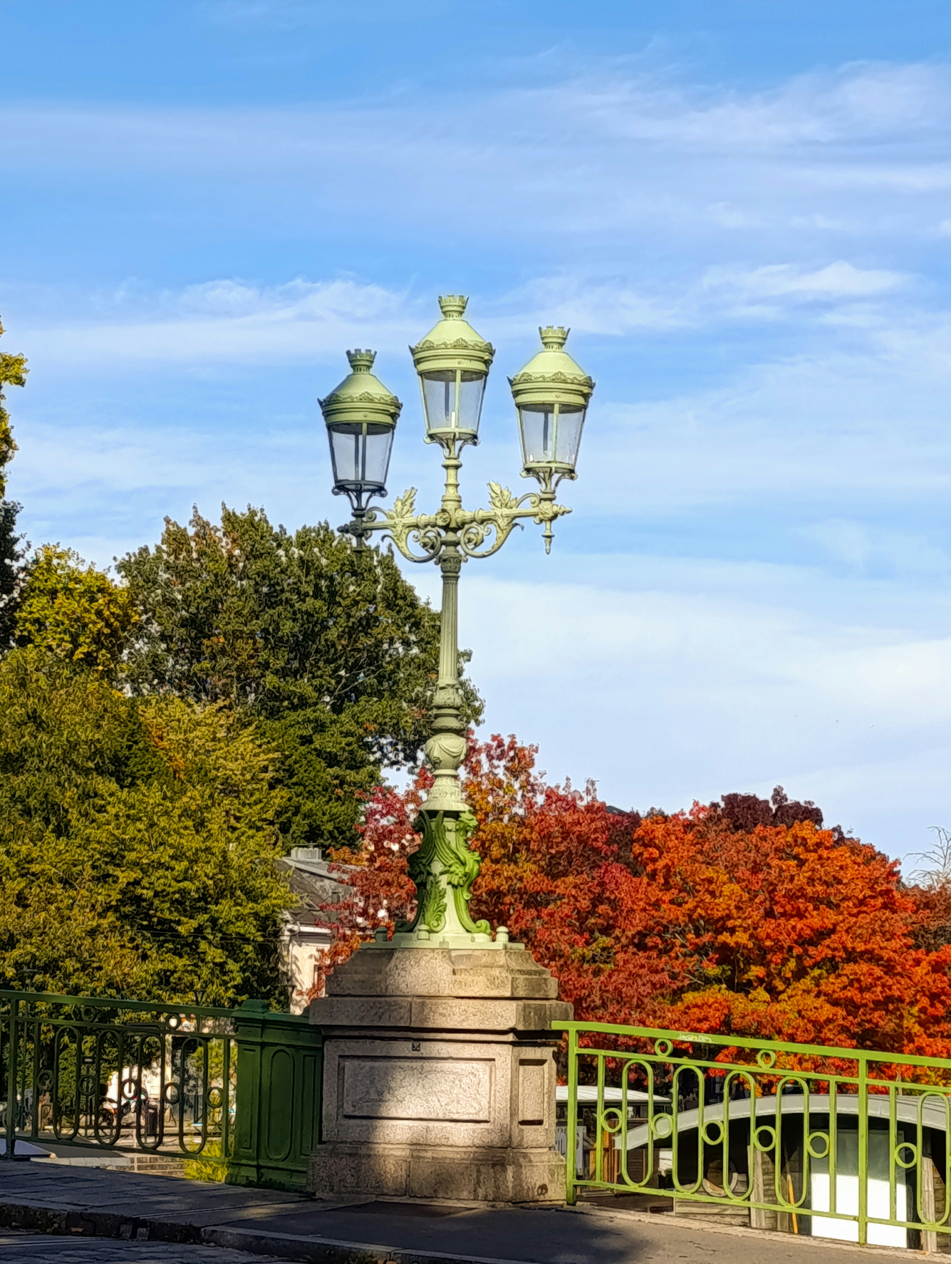 Lamppost in Autumn Light Over the Riverbank