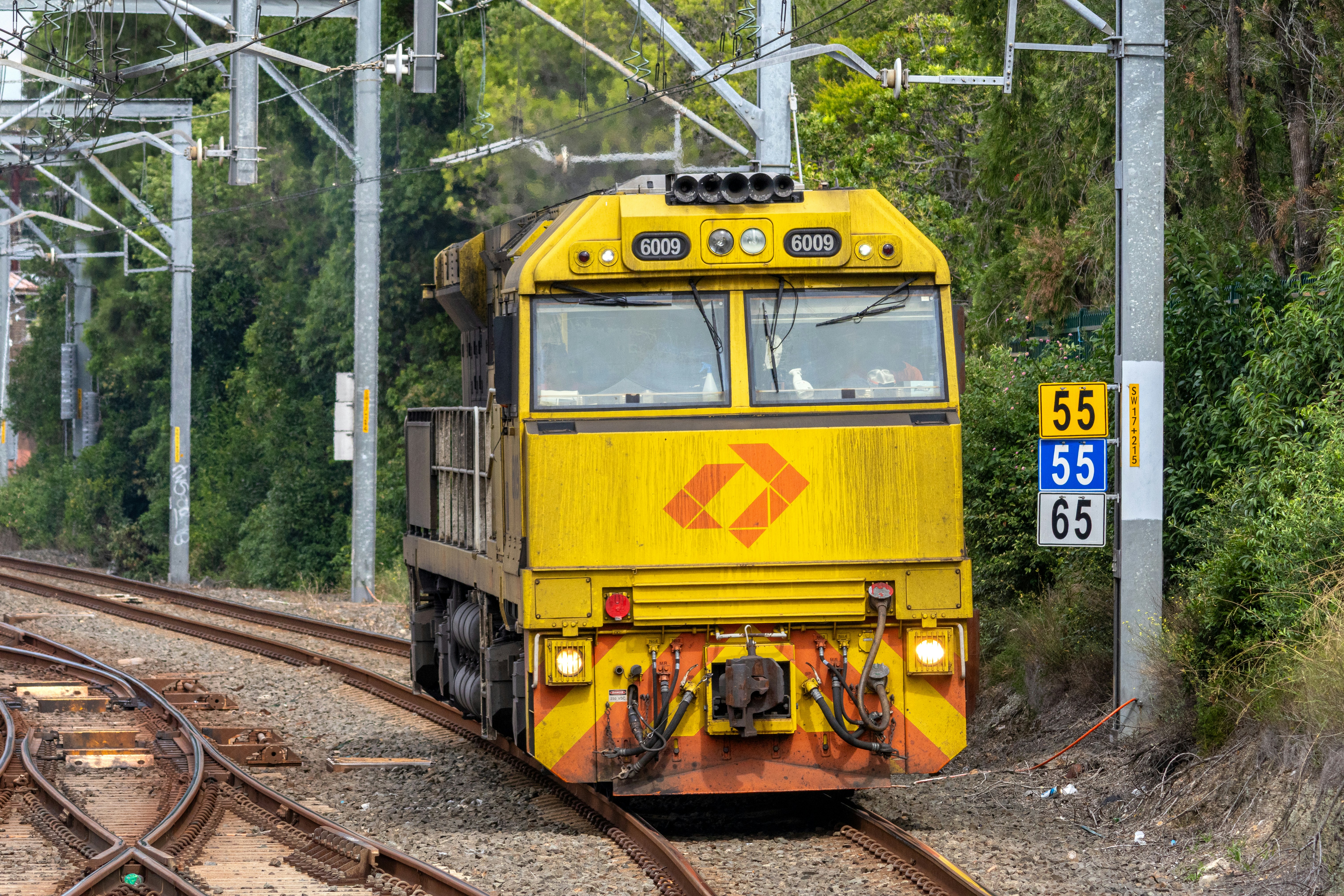 Yellow Locomotive Stalwart on Curved Rails