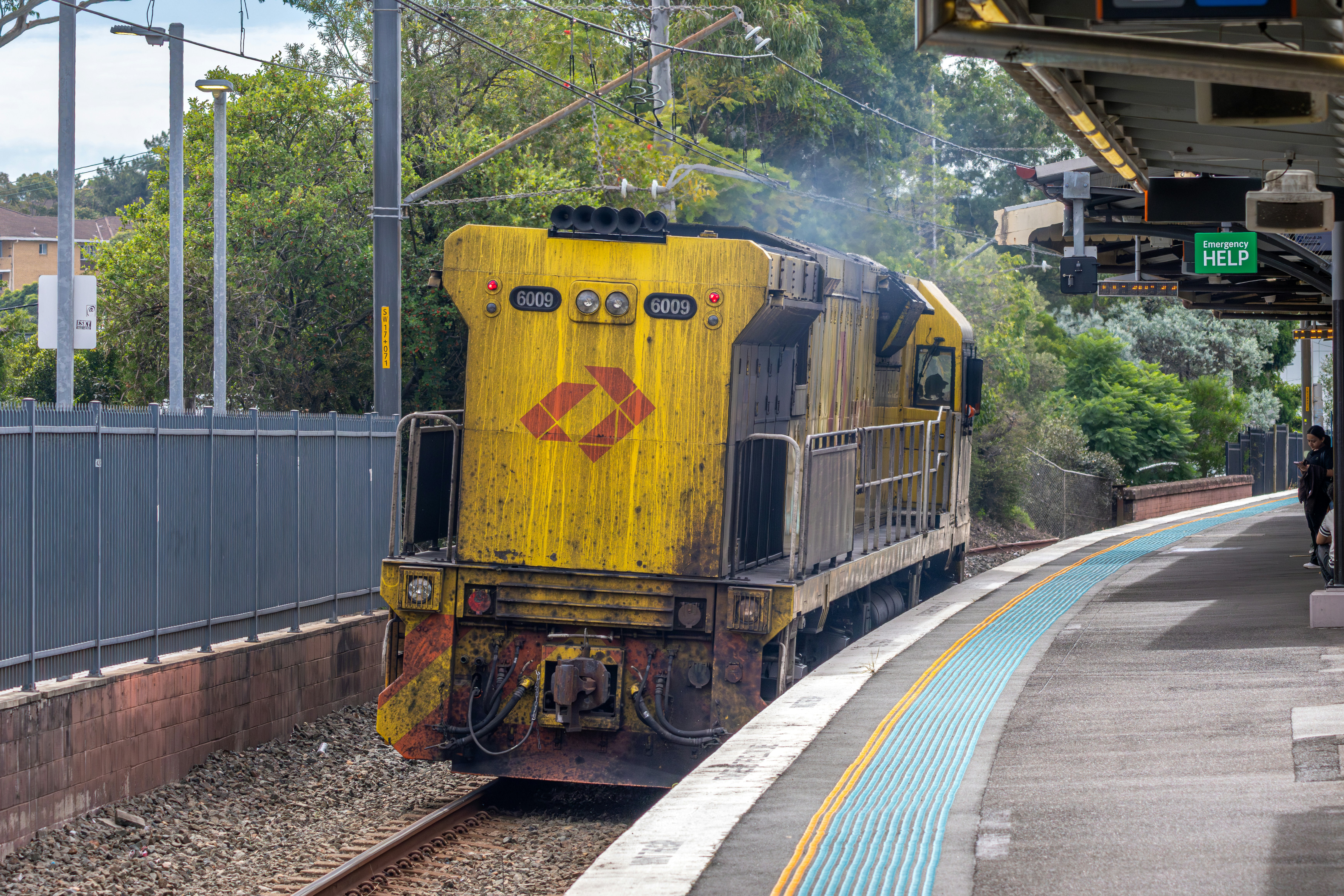 Dusty Westbound Themed Freight at Platform Edge