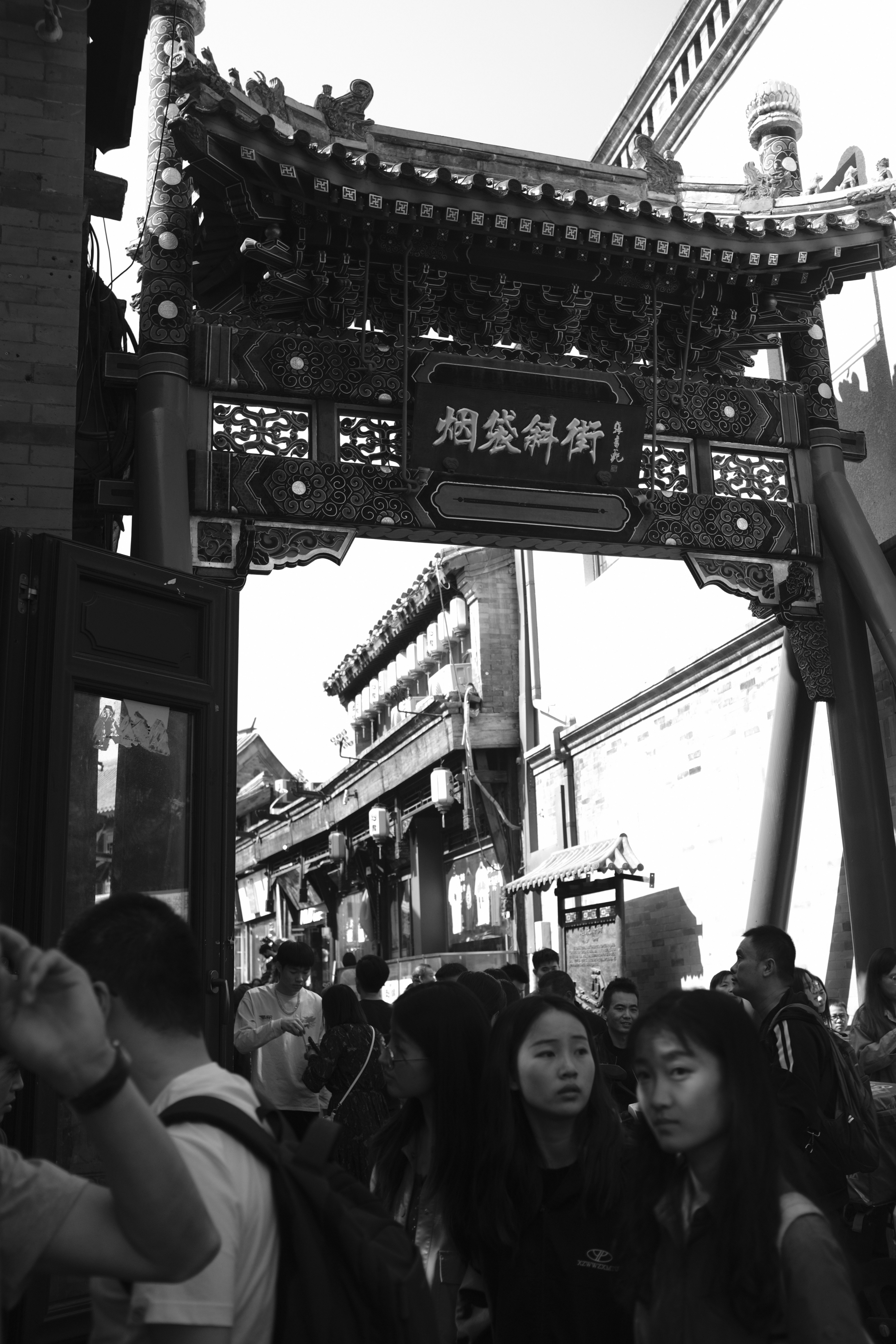 Gate of Echoes: Street Scene beneath an Elaborate Arch