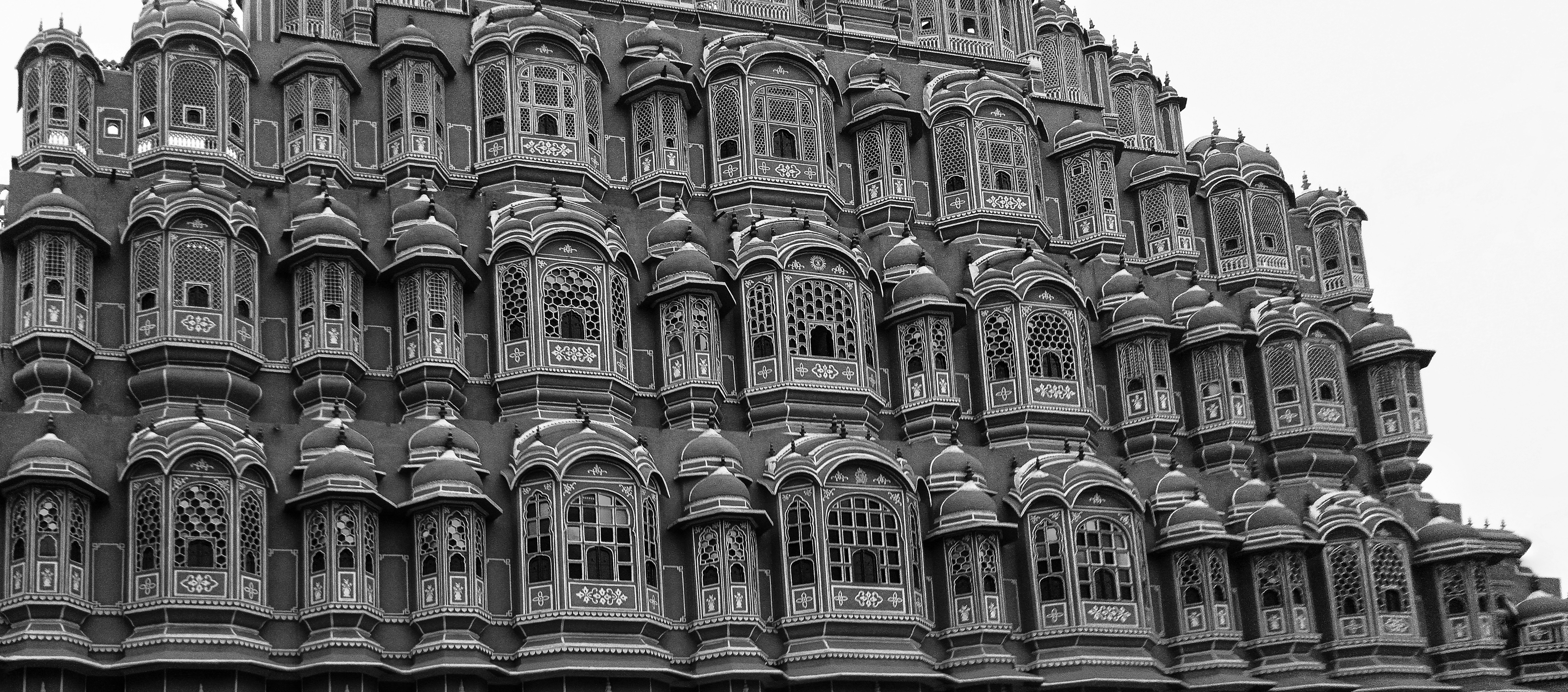 Ornate Facade Mosaic: Repetition in Stone and Light