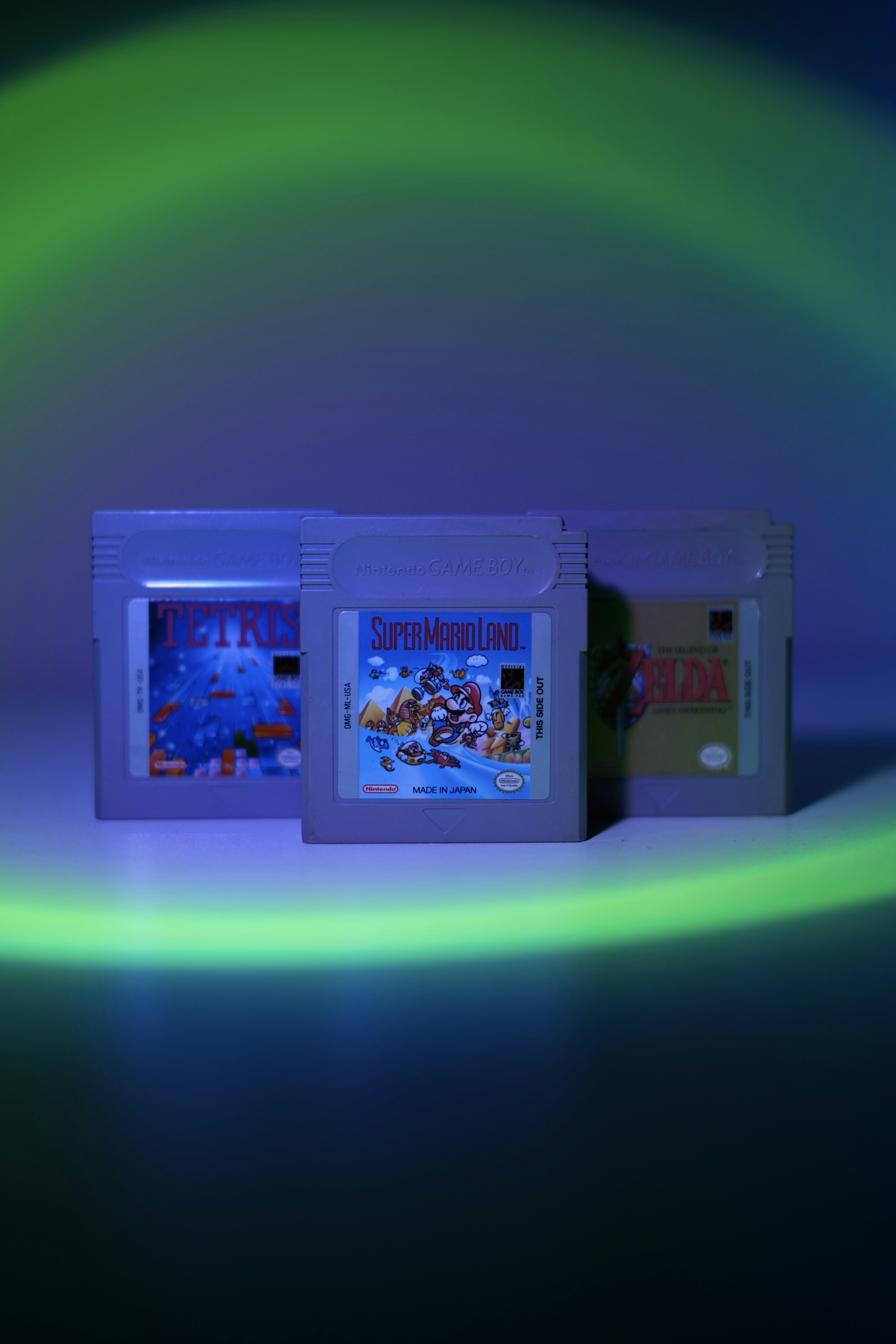 Retro cartridge trio under neon arc glow