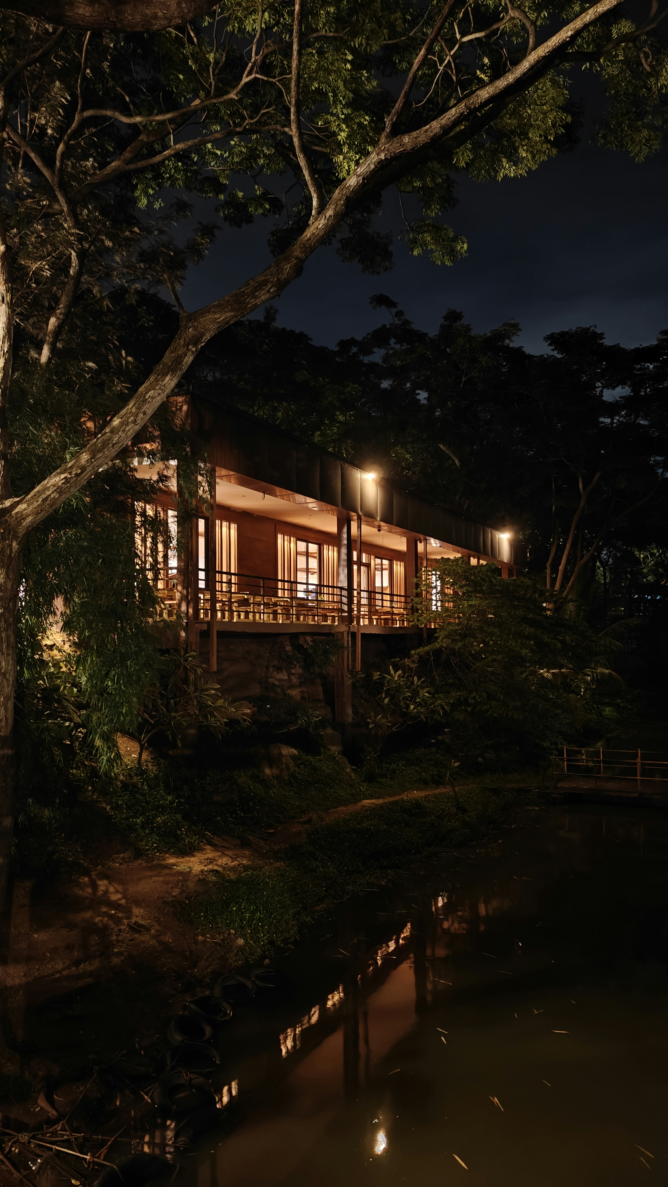 Moonlit Lodge Over the River