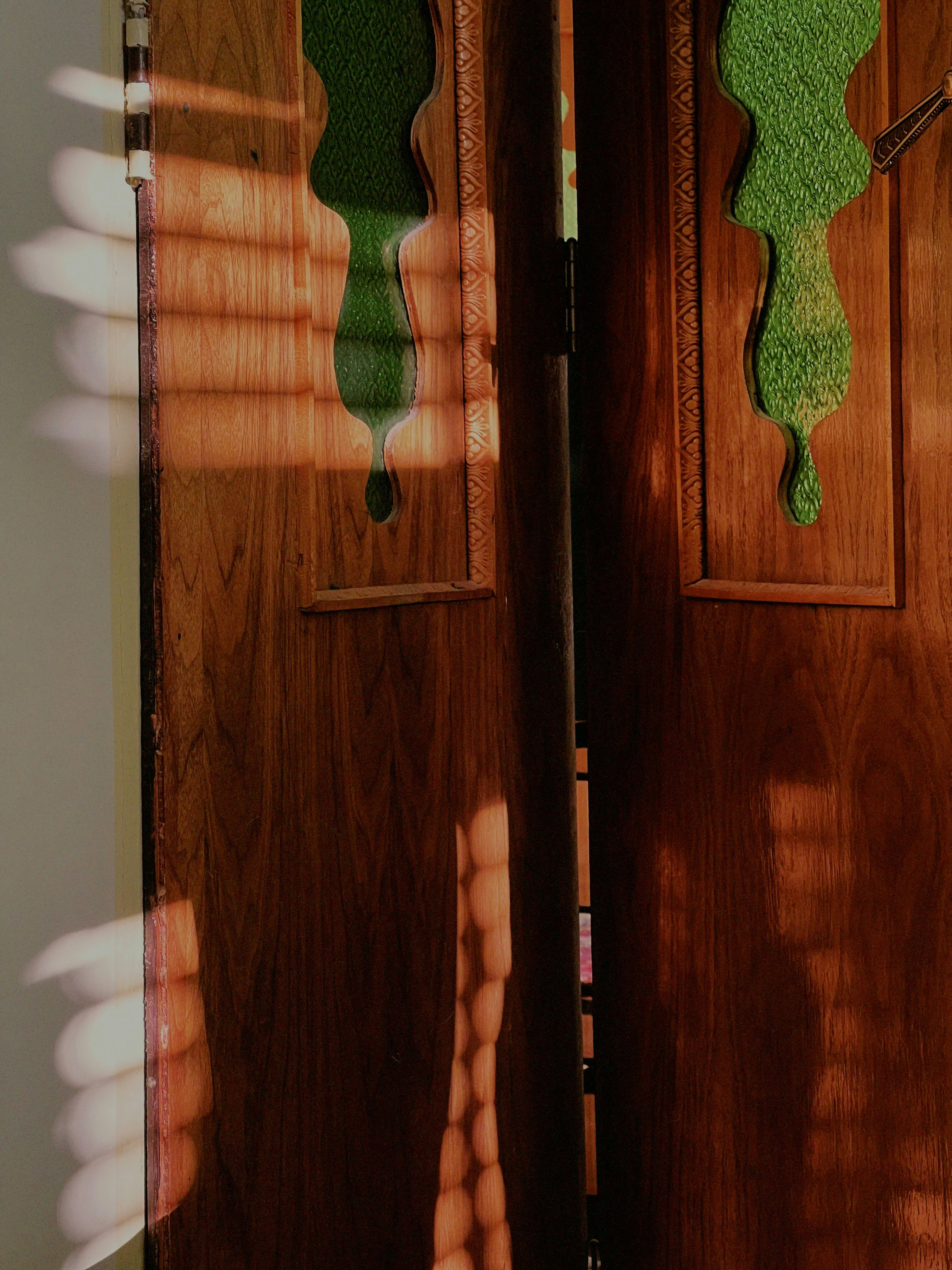 Sunlit Wood Panels Behind a Narrow Gap
