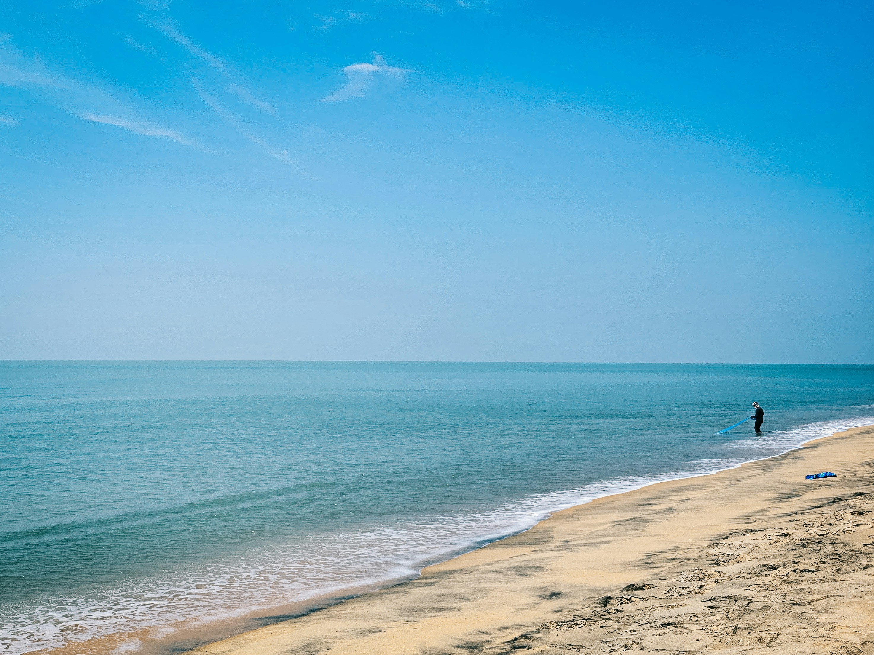 Lone Surfer Echoes on a Quiet Morning Shore