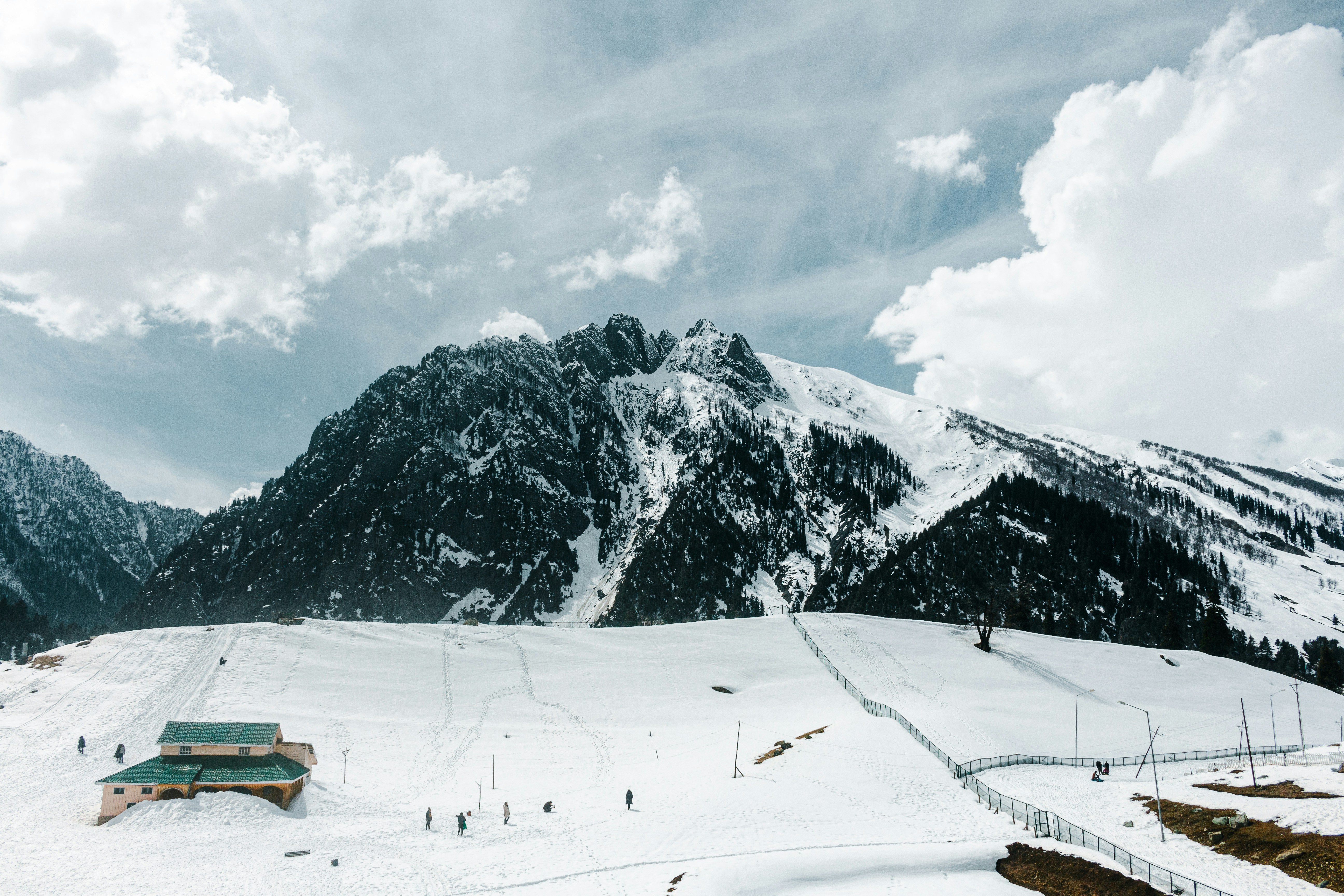 Snowbound Ridge: A Quiet Alpine Outpost Beneath Towering Peaks