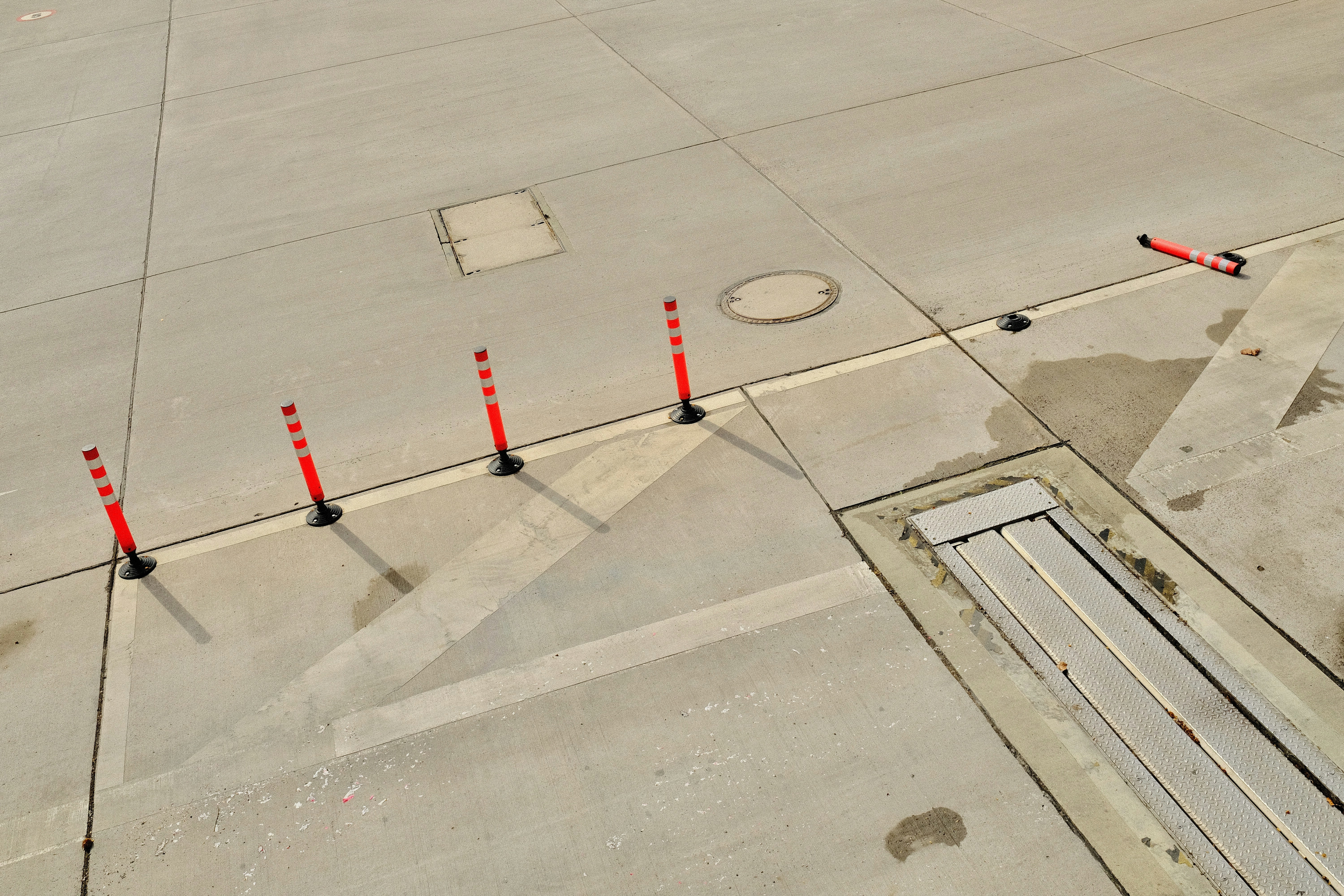 Raised Markers on a Quiet Concrete Runway Edge