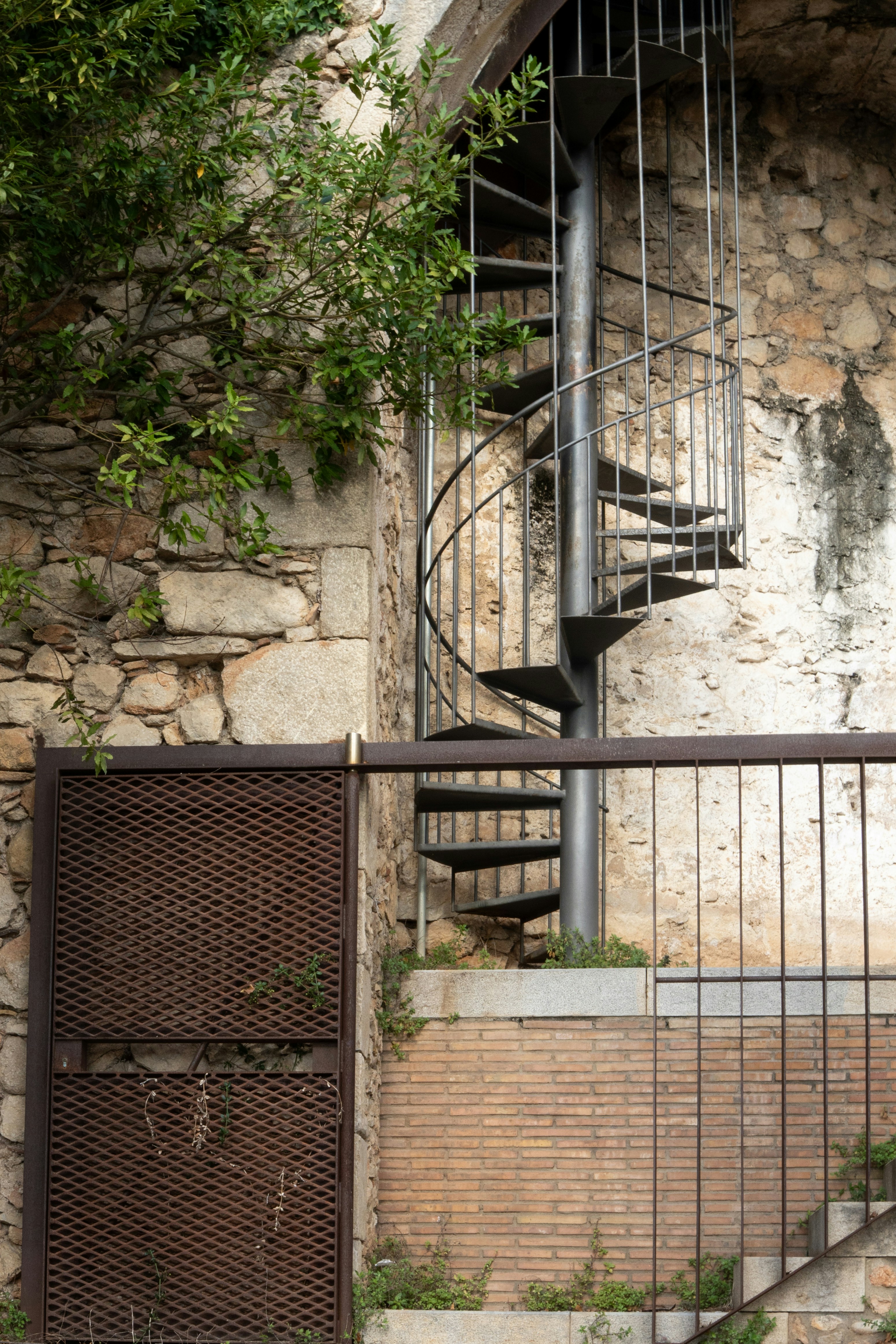 Spiral Staircase Amid Crumbling Walls
