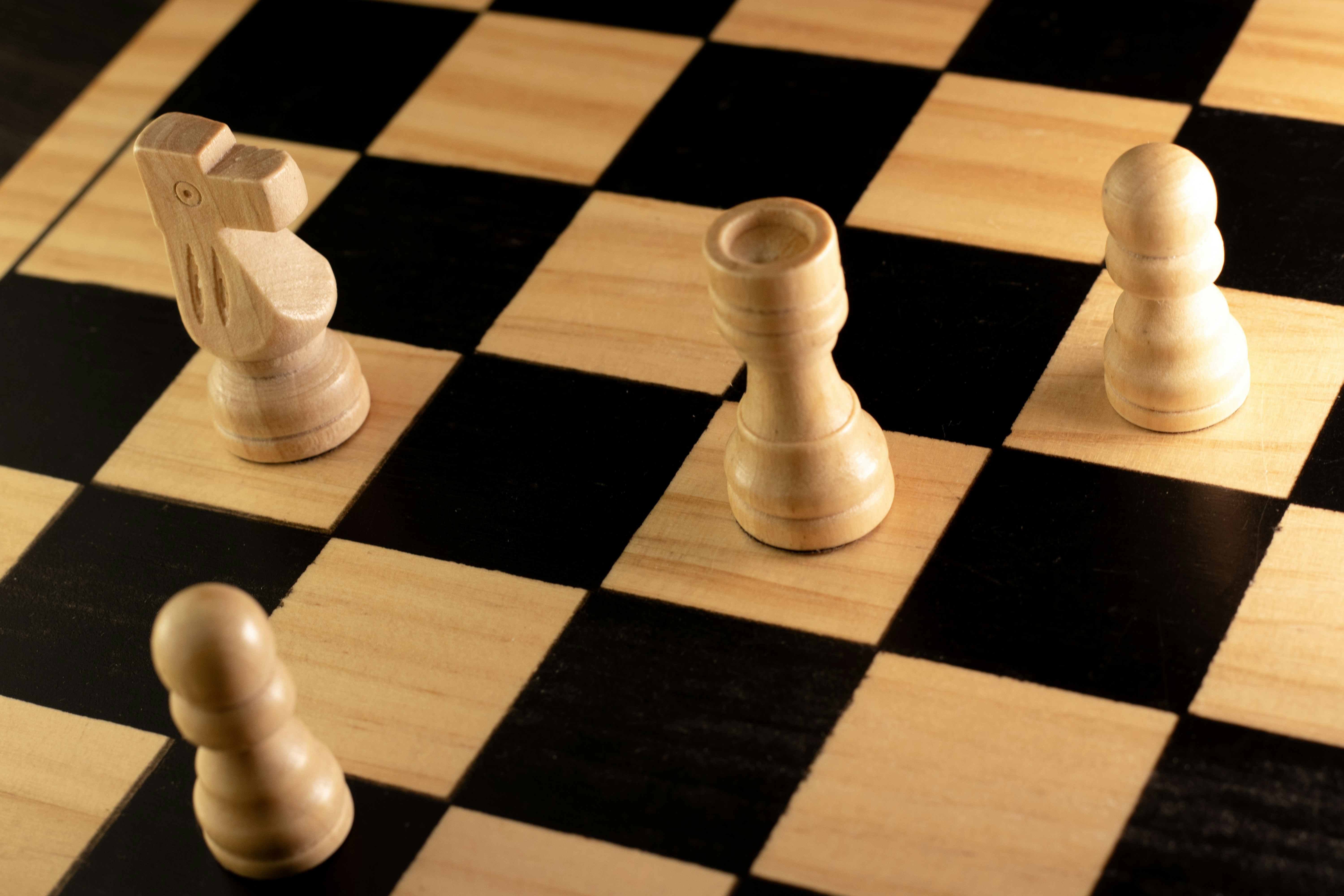 Sparse Endgame: White pawns and a lone rook-like piece in a quiet chessboard moment