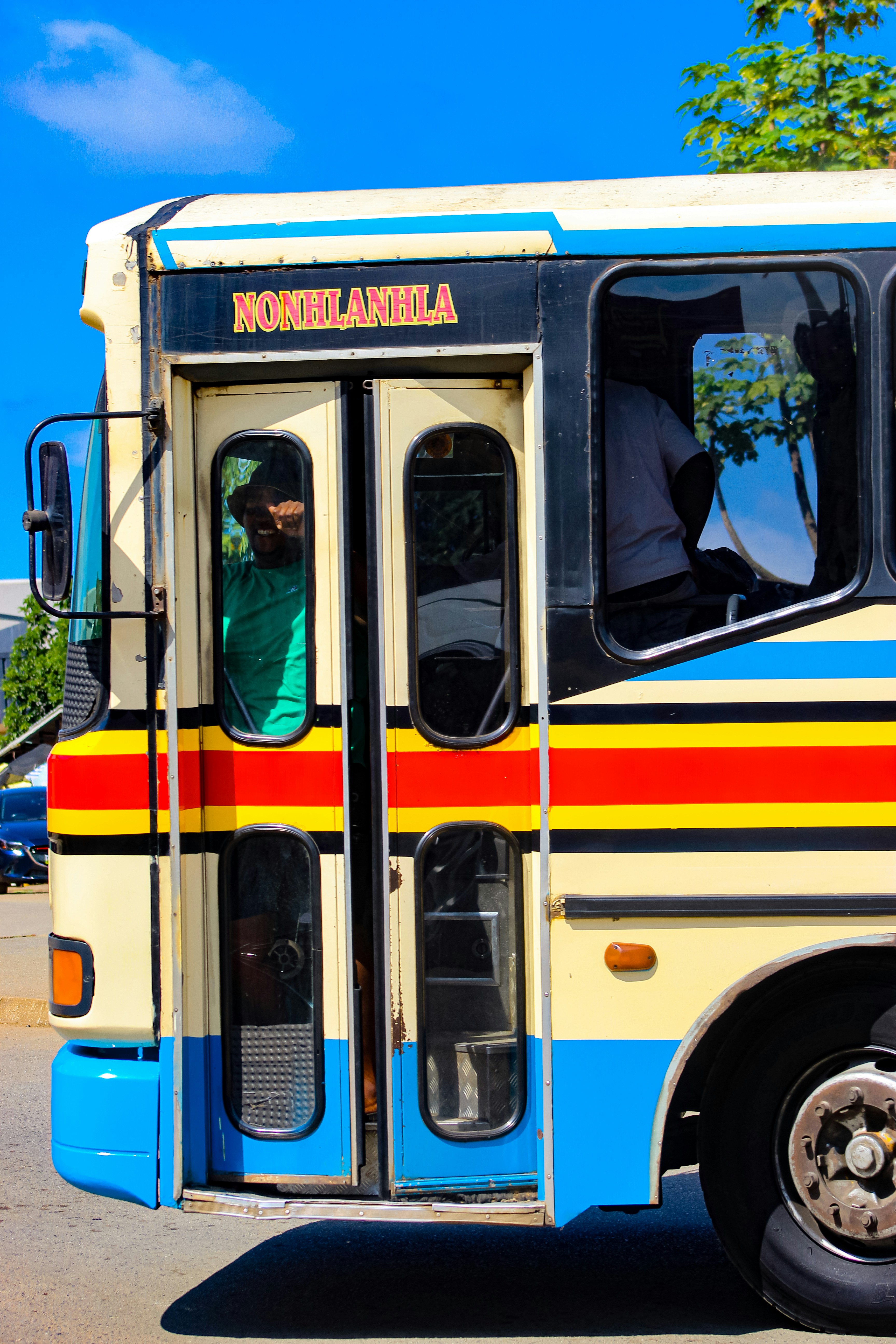 Colorful Bus Front Close-Up with Open Door