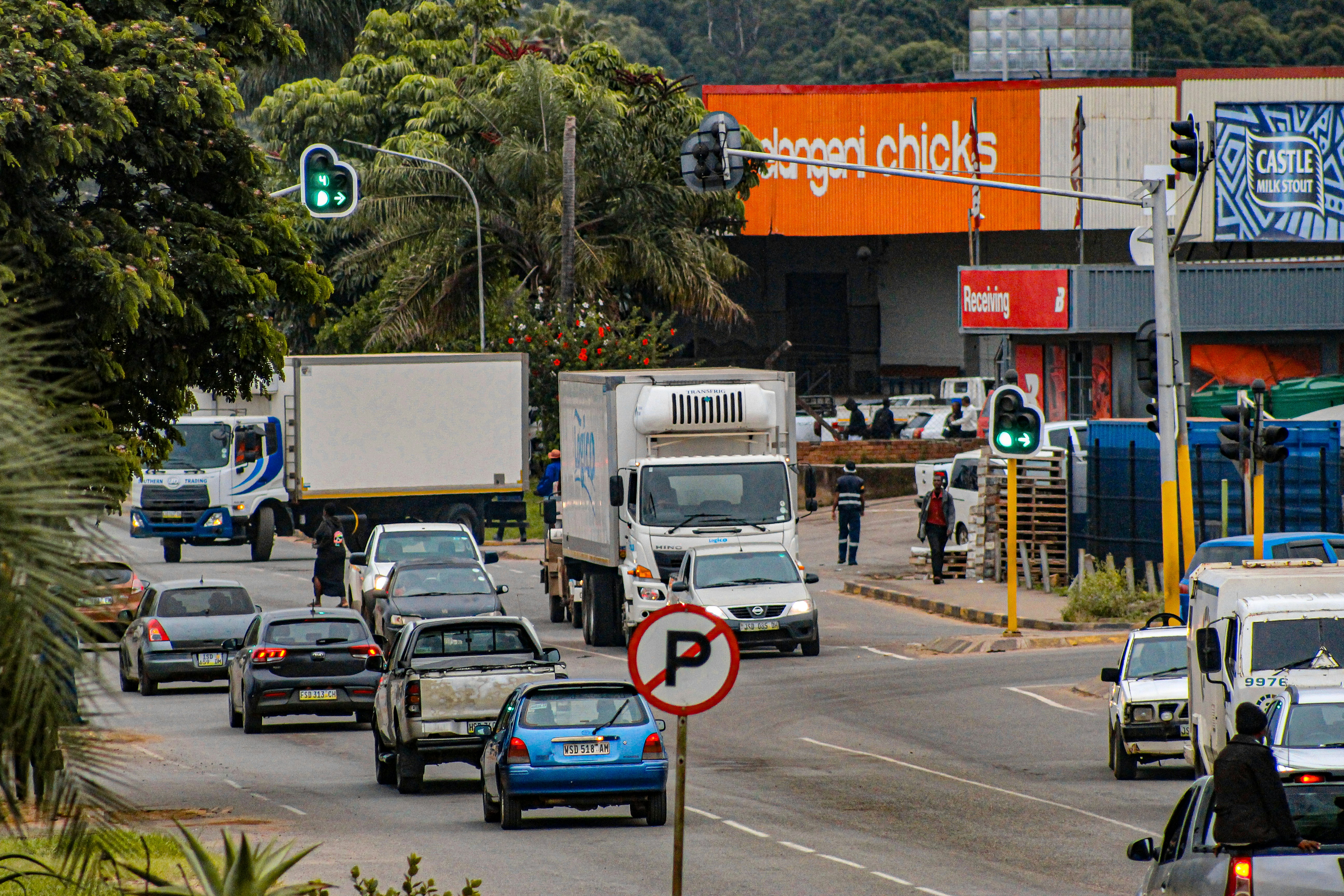 Urban Crossroads Under an Orange Sign